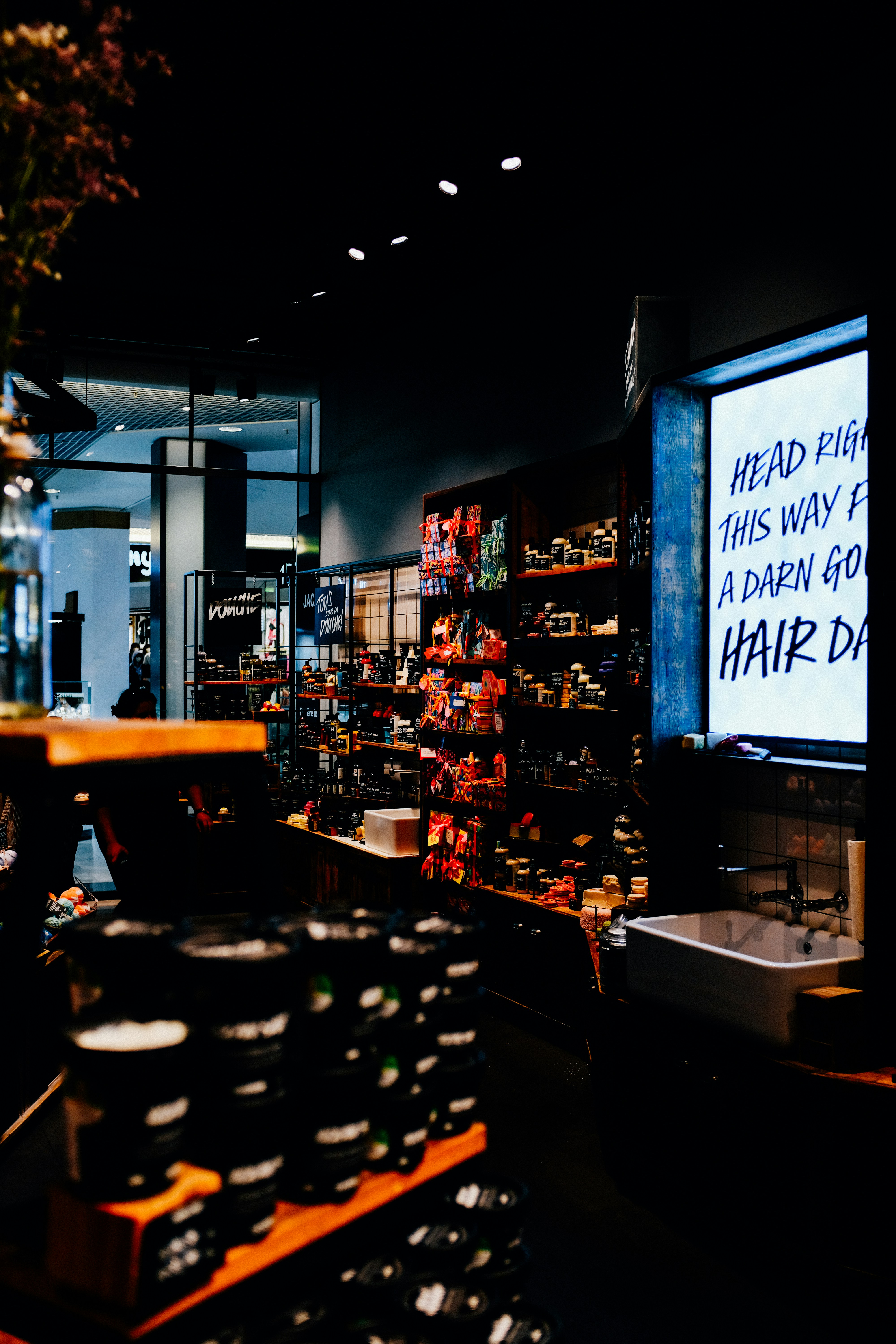 Neon Signage and Shelves: A Quiet Moment in a Grooming Aisle