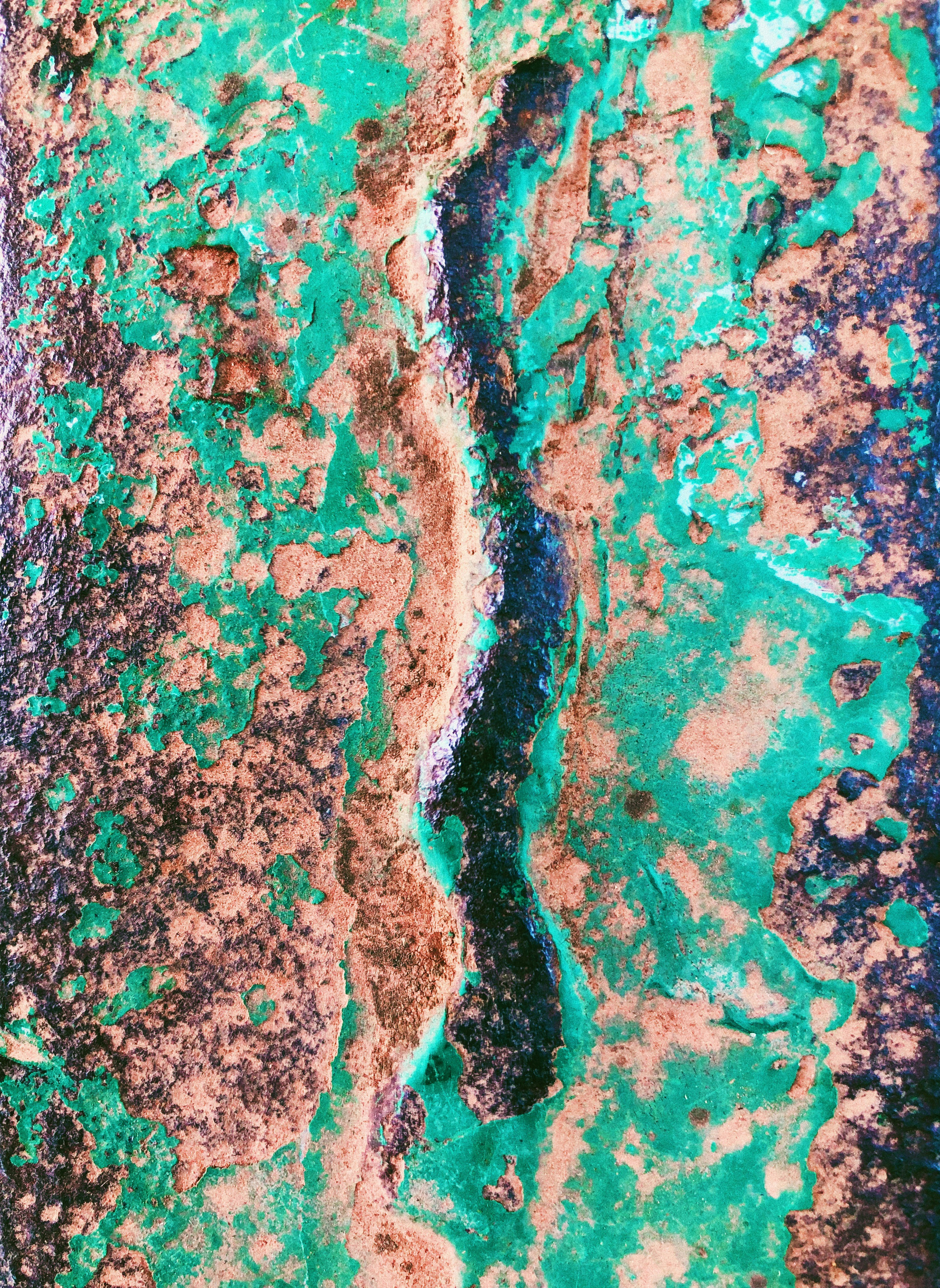 Verdigris Canyon: a teal crack through rusted metal