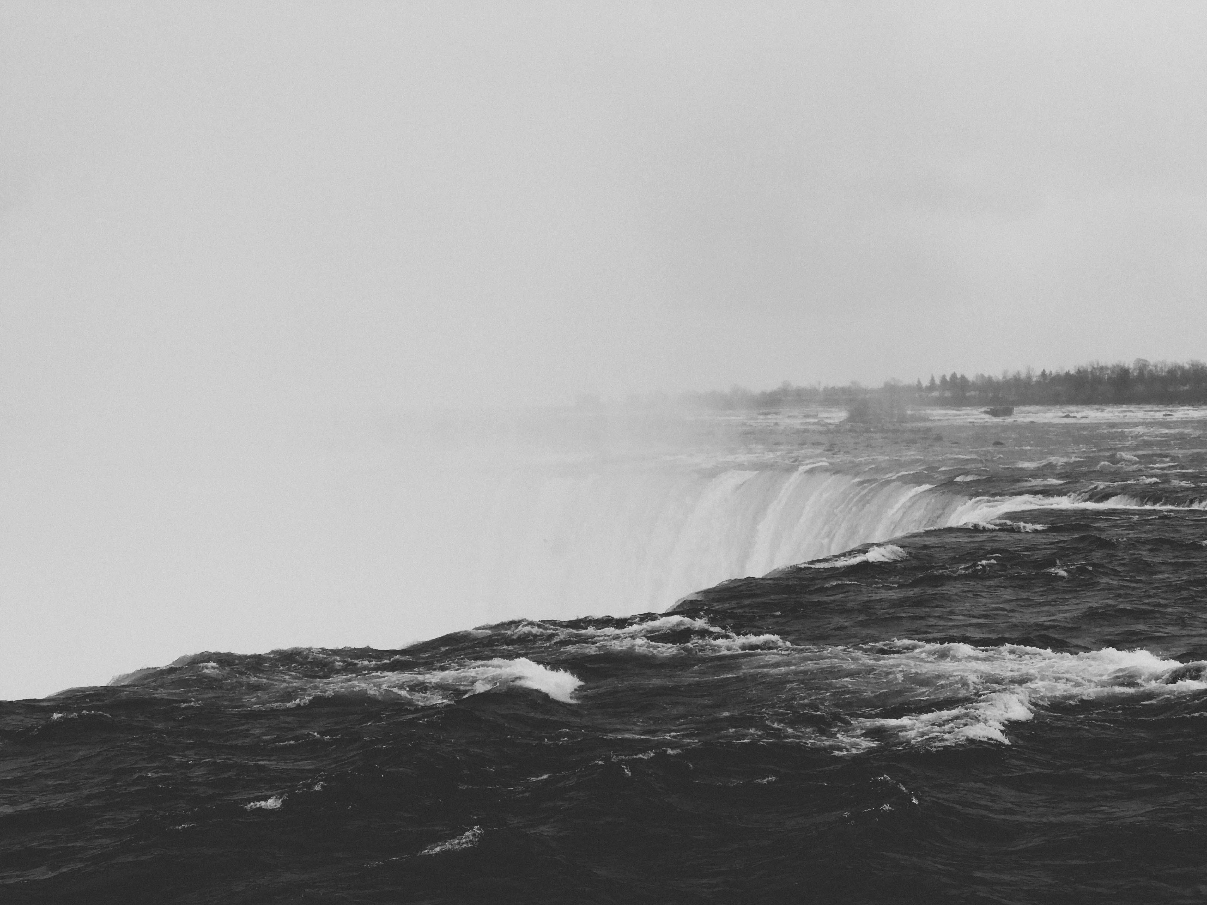 Edge of the Veil: Monochrome Mist at the Falls