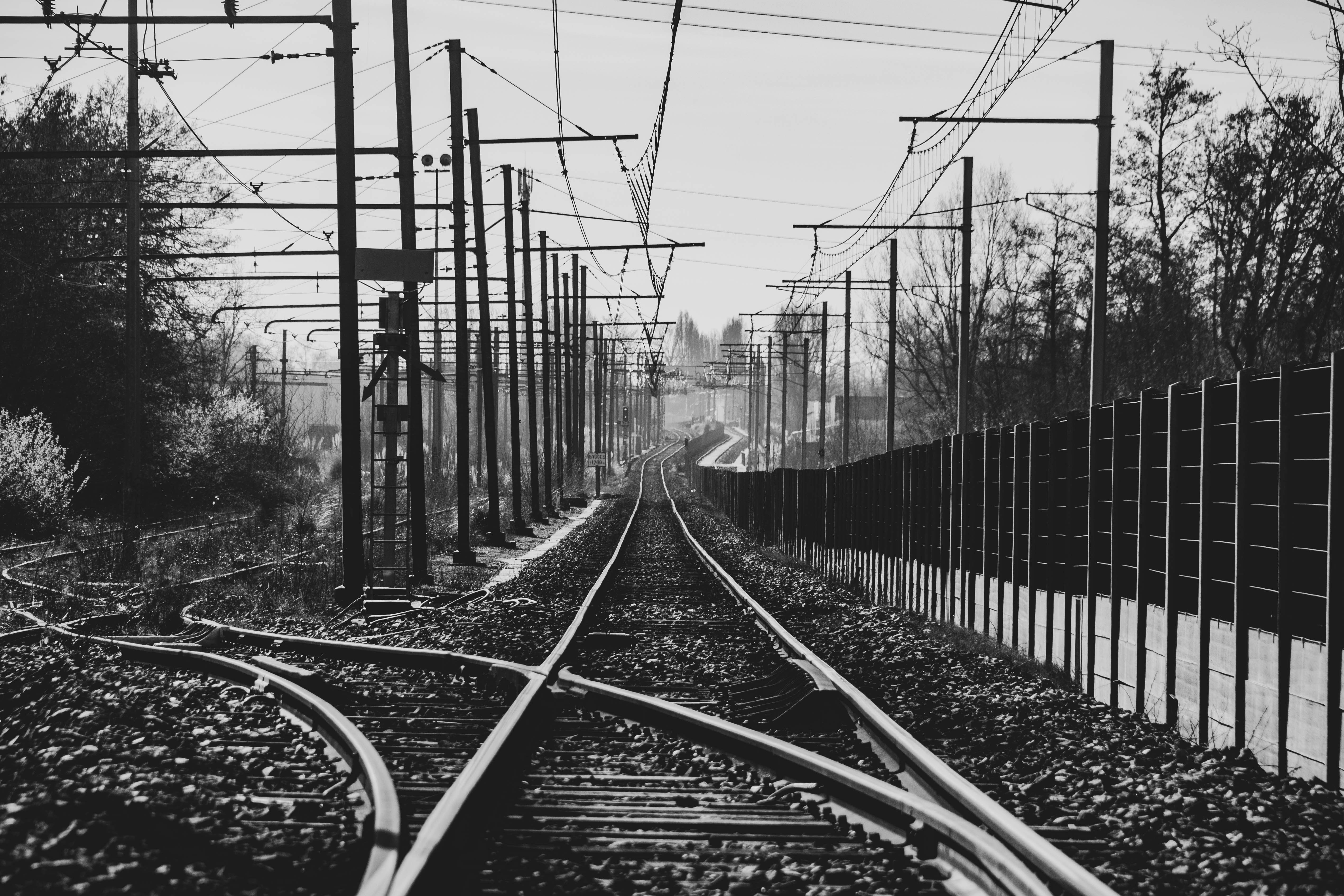 Grayscale photo of train rail photo – Free Grey Image on Unsplash