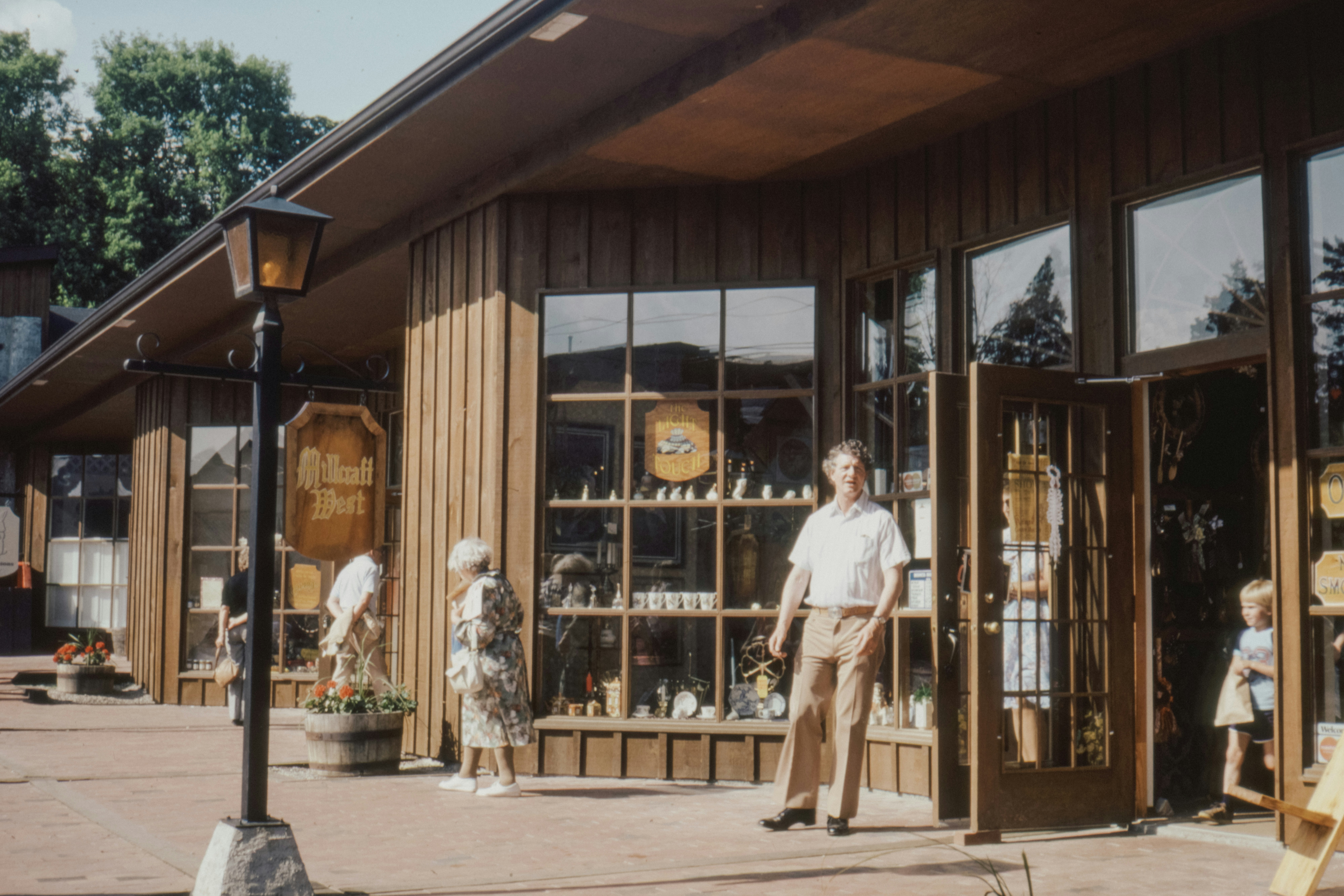 Sunlit Shopfront: A Quiet Moment by the Wooden Facade