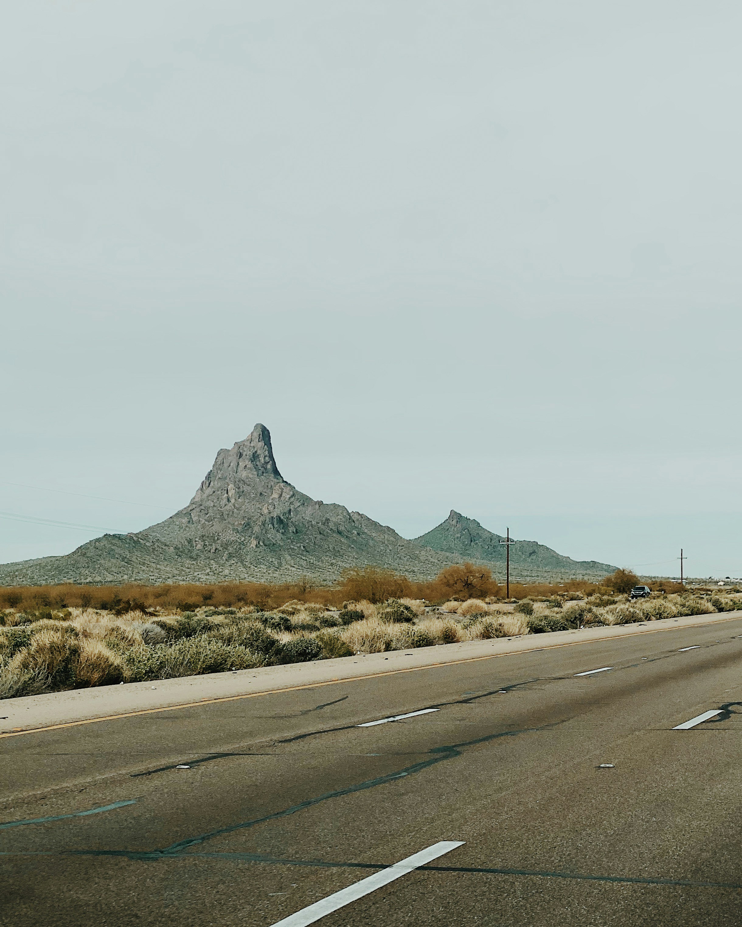 Desert Highway Toward a Distant Peak
