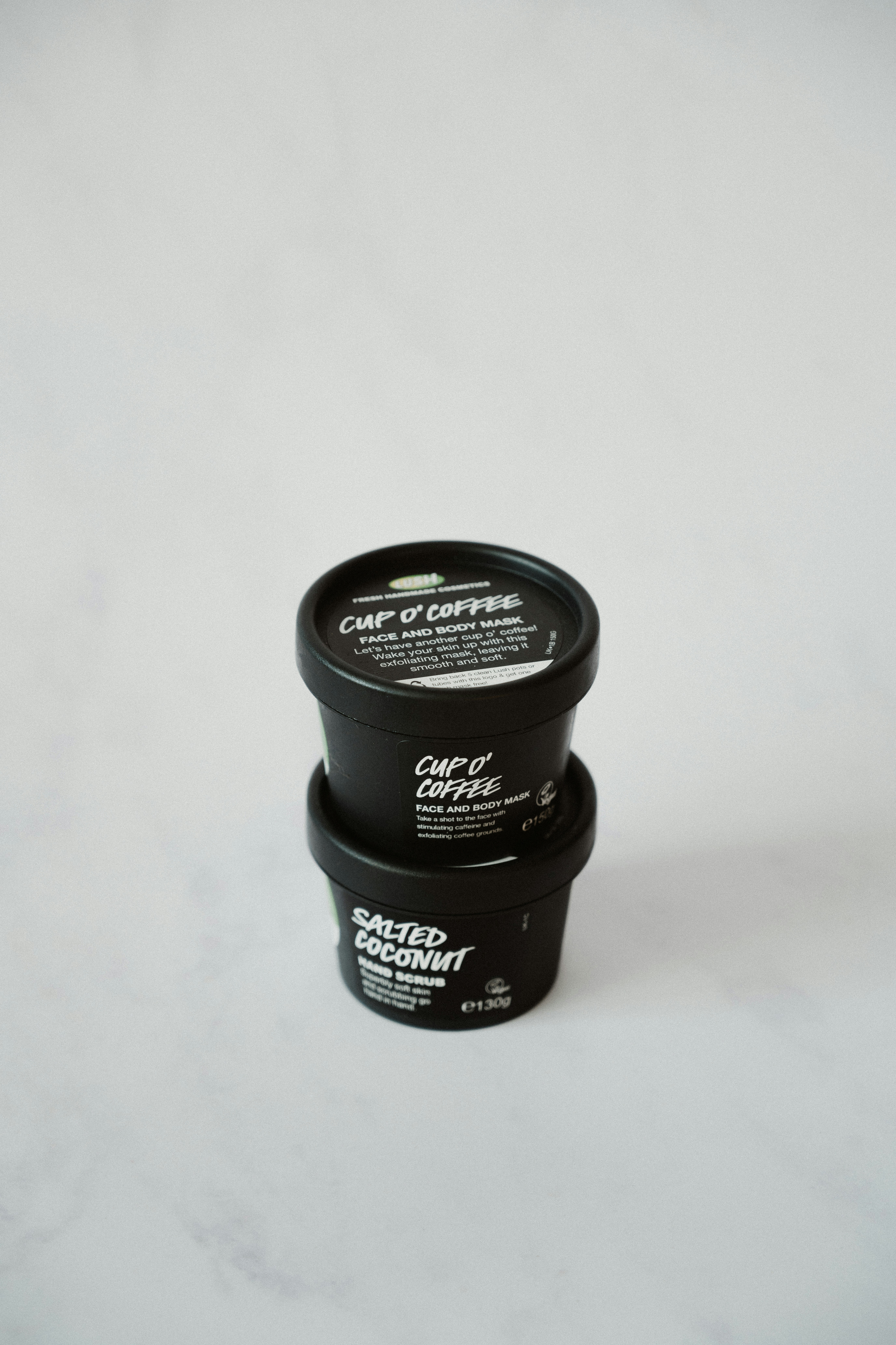 Stacked Cup o' Coffee and Salted Coconut on Marble: A Minimalist Skincare Still Life