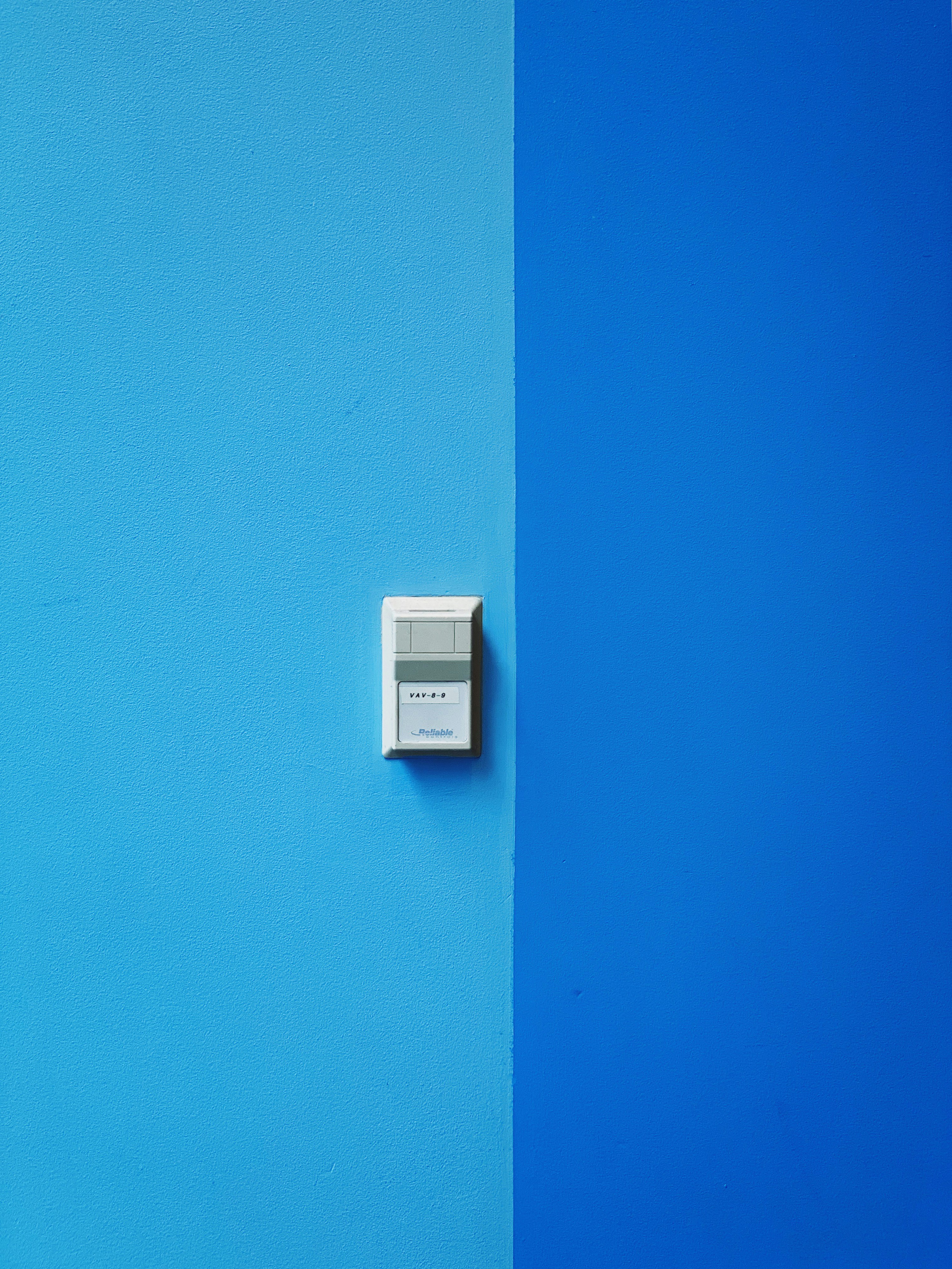 Split-Blue Interface: A Minimalist Meter Box on a Dual-Toned Wall