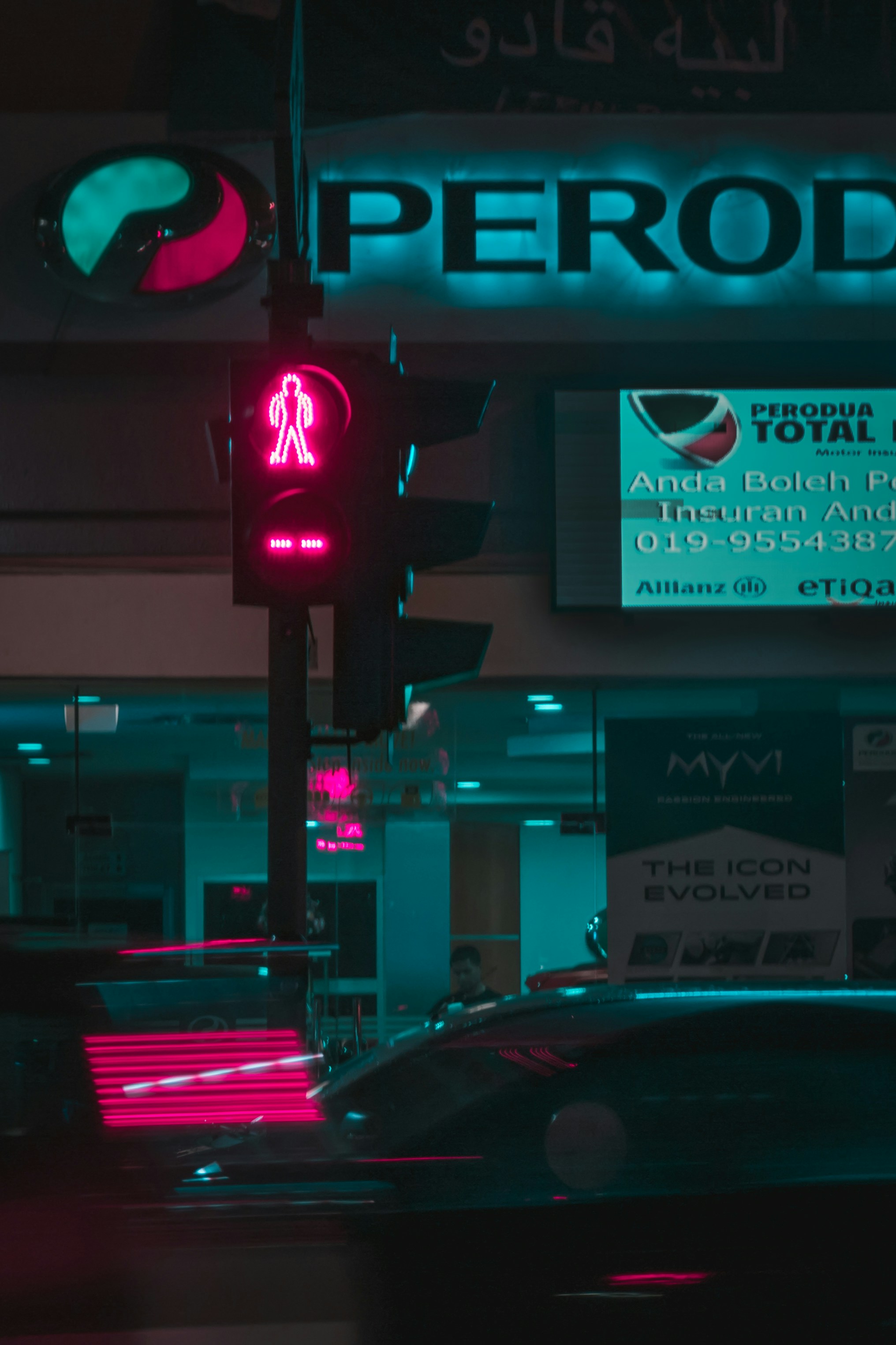 Neon Crosswalk: Magenta Pedestrian Signal in a Teal Night Market
