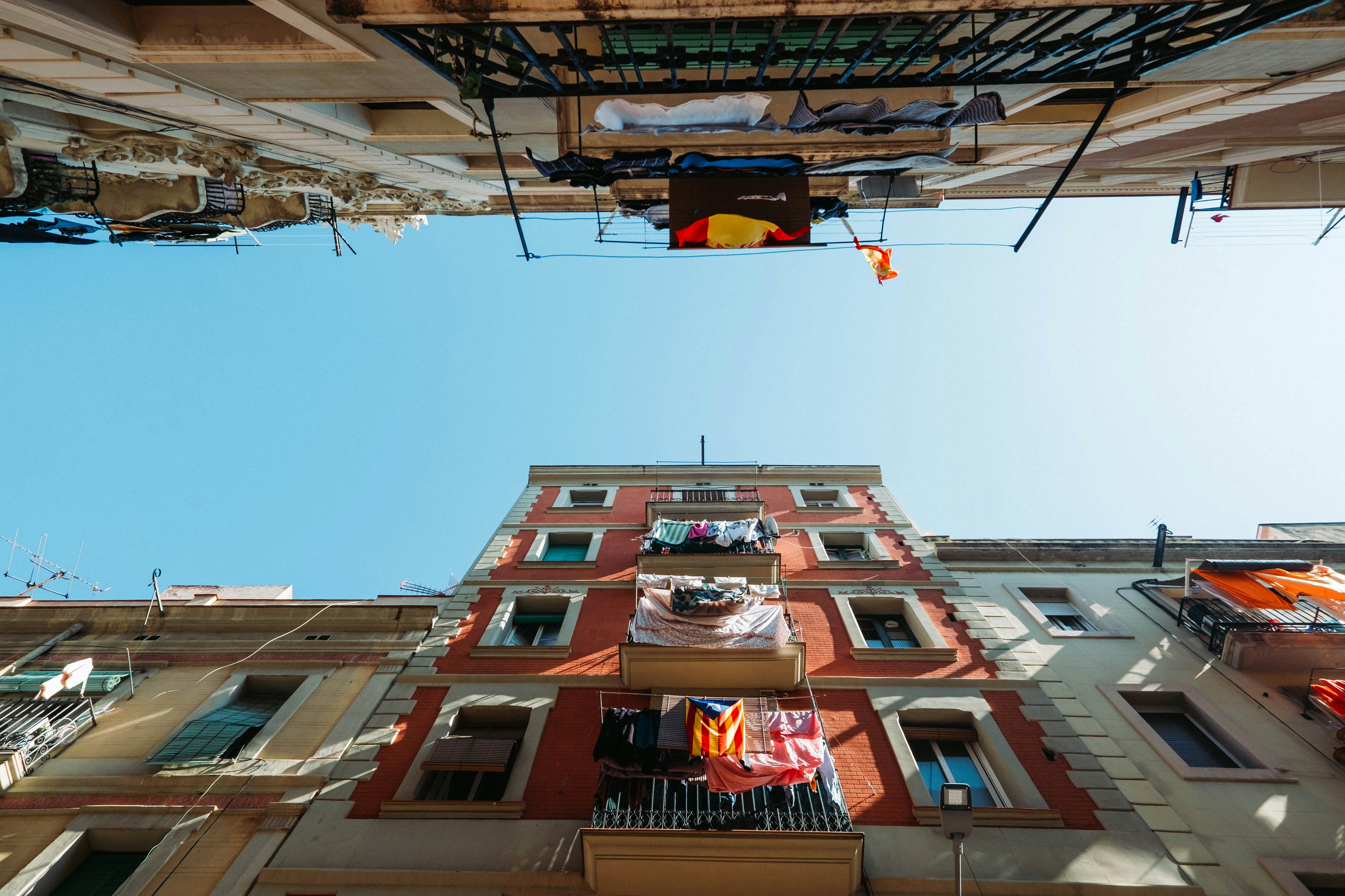 Balconies in Sunlit Sky: An Urban Facade in Tilt-Down Perspective