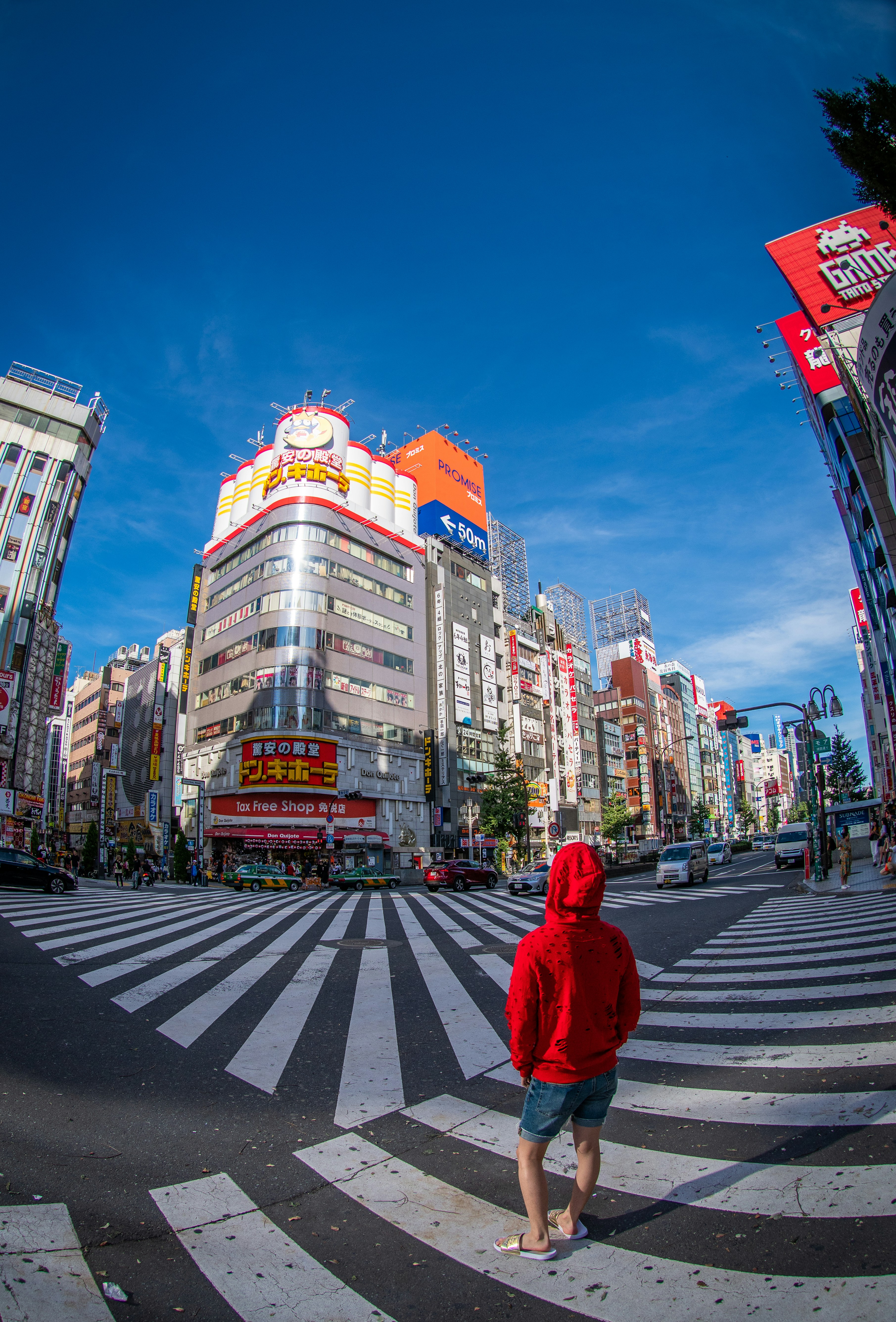 Red Hoodie at the Crosswalk: Neon City Shadow