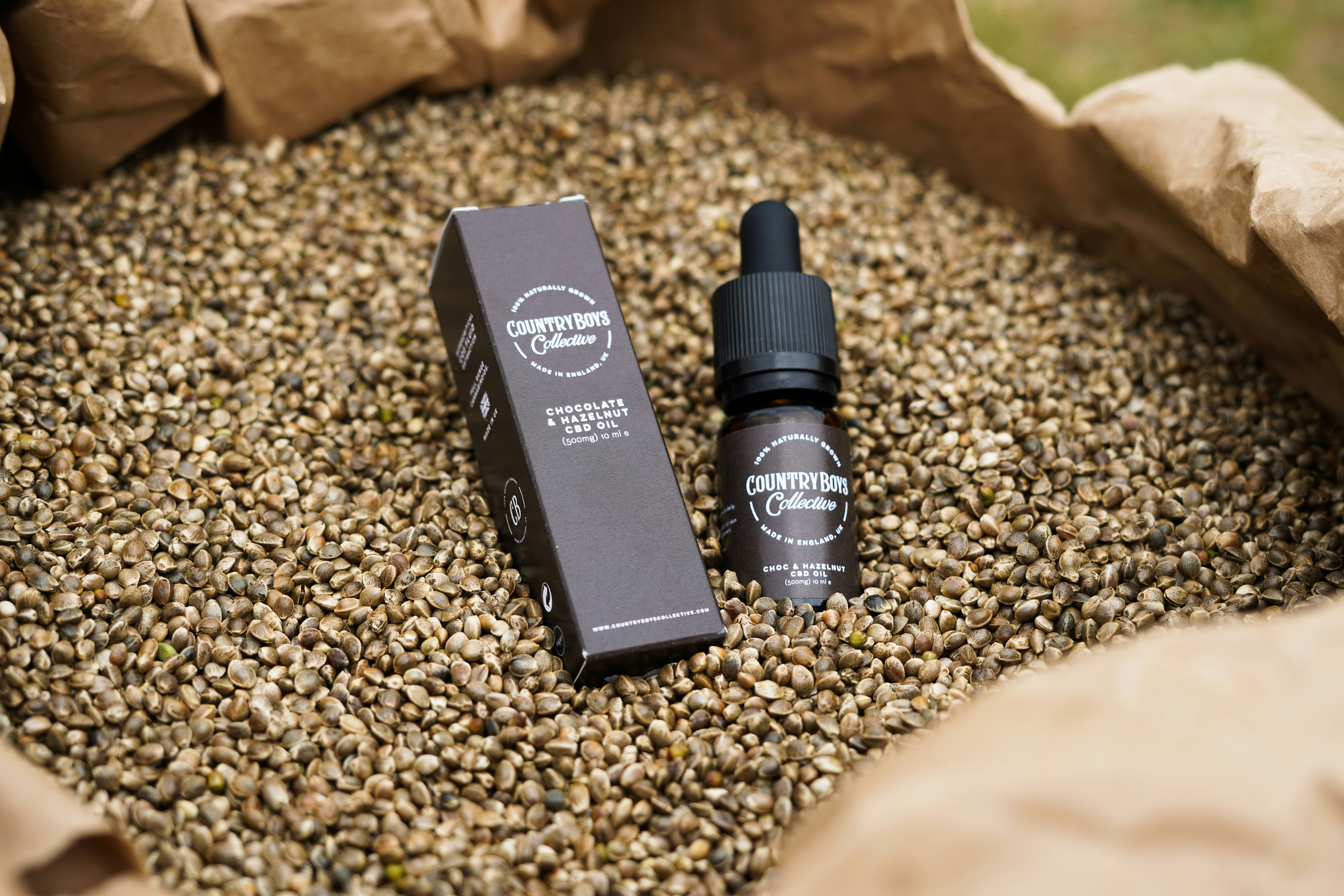 Country Boy CBD Oil Nestled Among Golden Coffee Beans