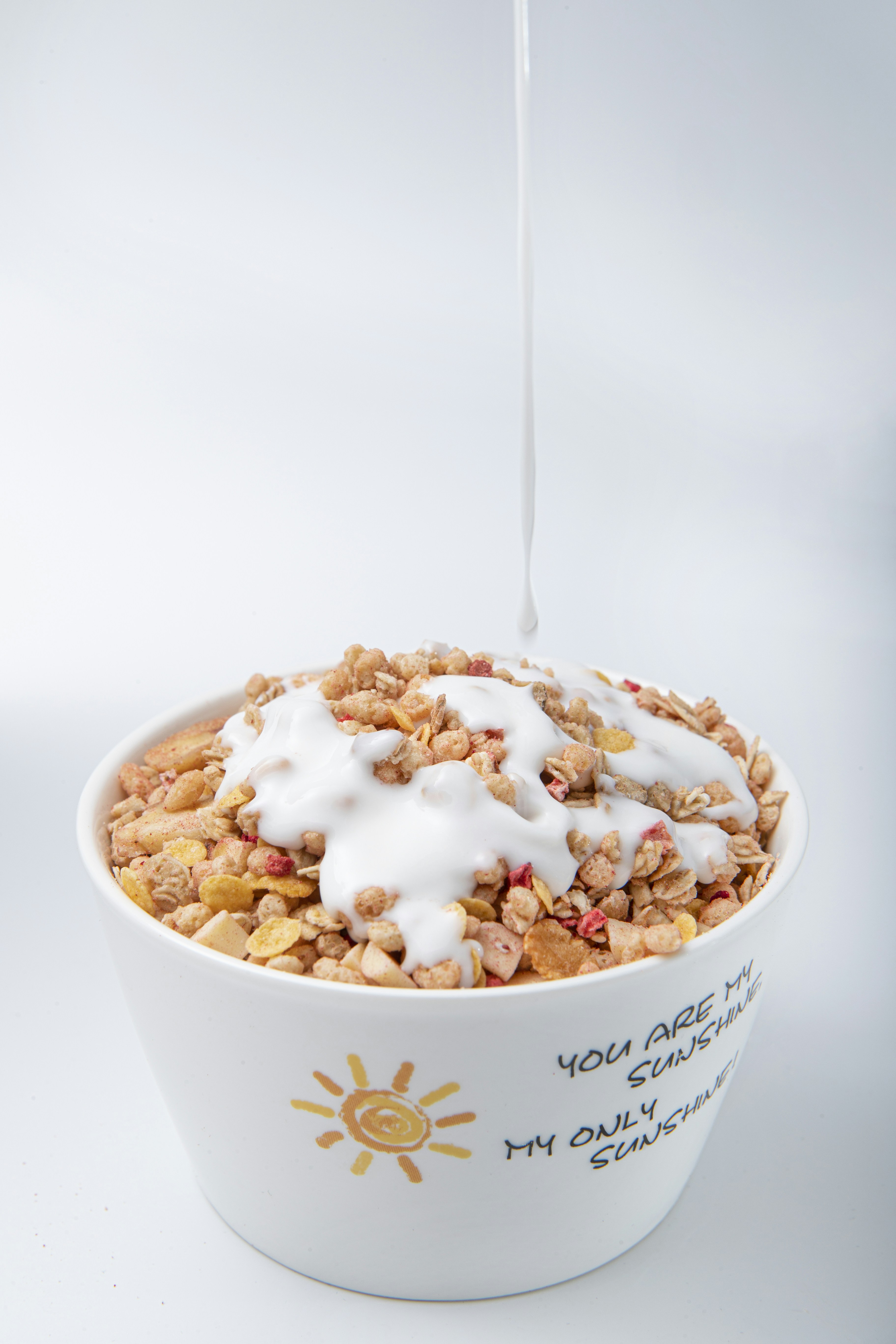 white and brown ceramic bowl with cereal