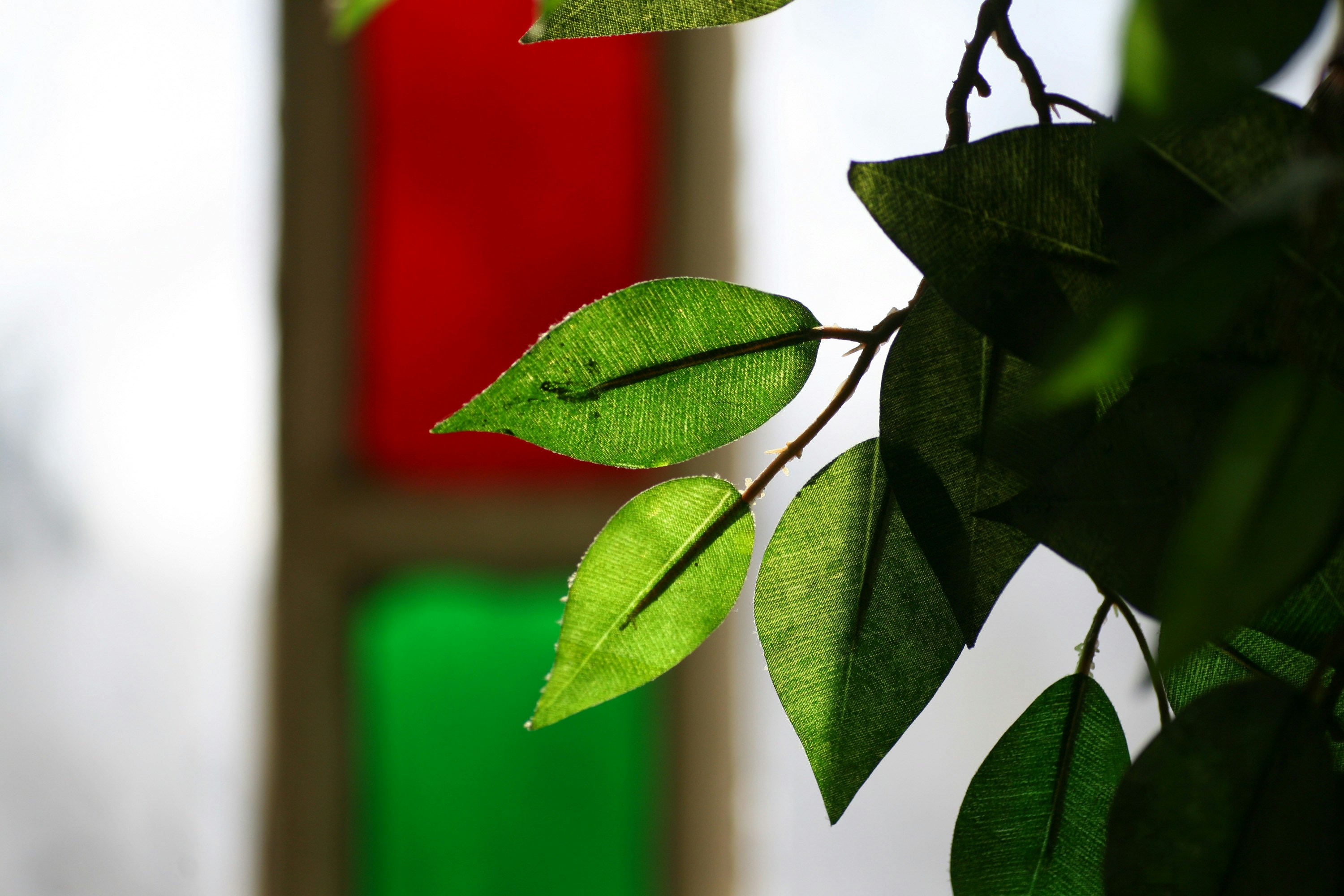 Emerald Leaves in Front of Stained Glass Accent