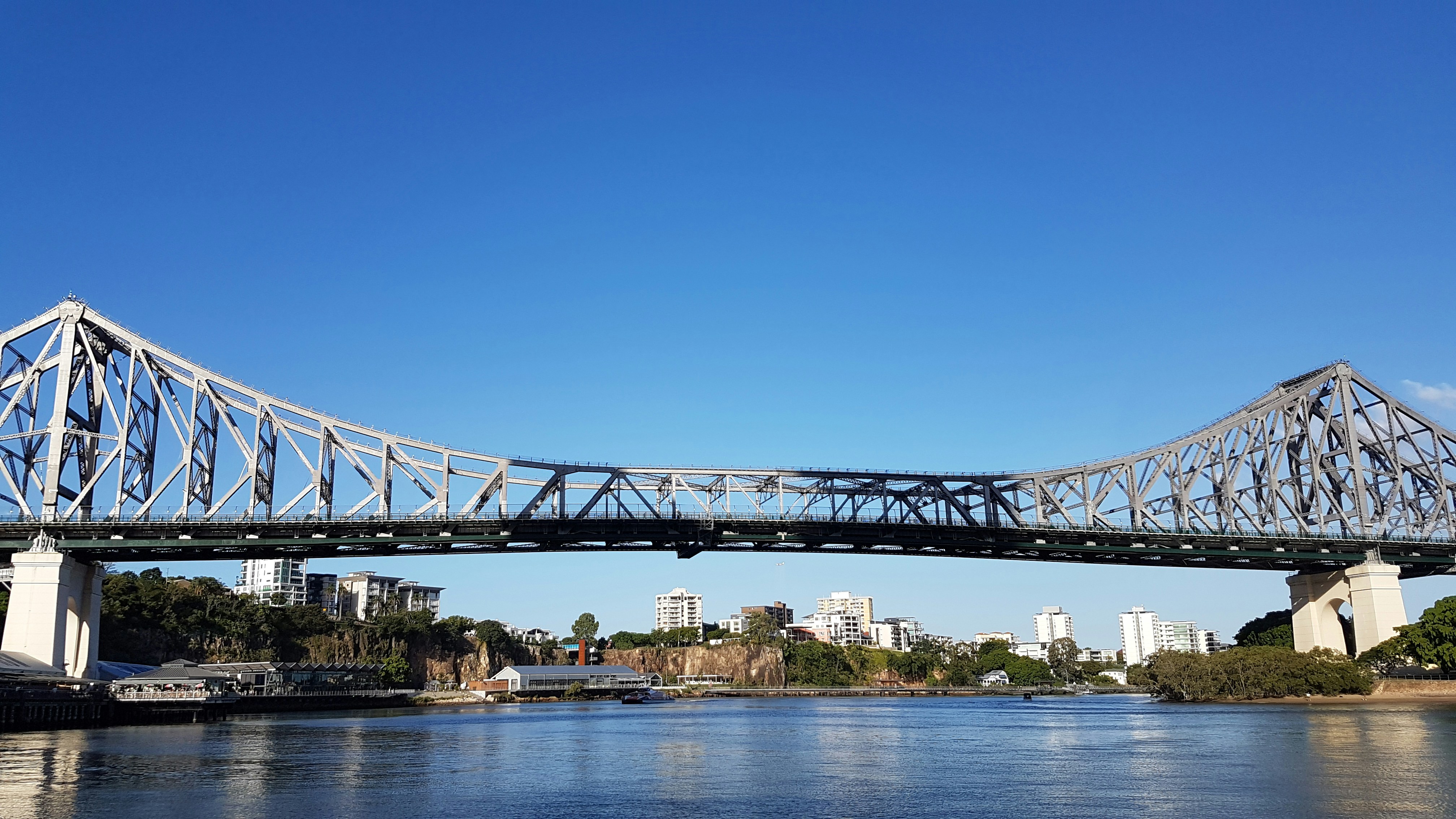 Bridge over river under blue sky during daytime photo – Free Building ...