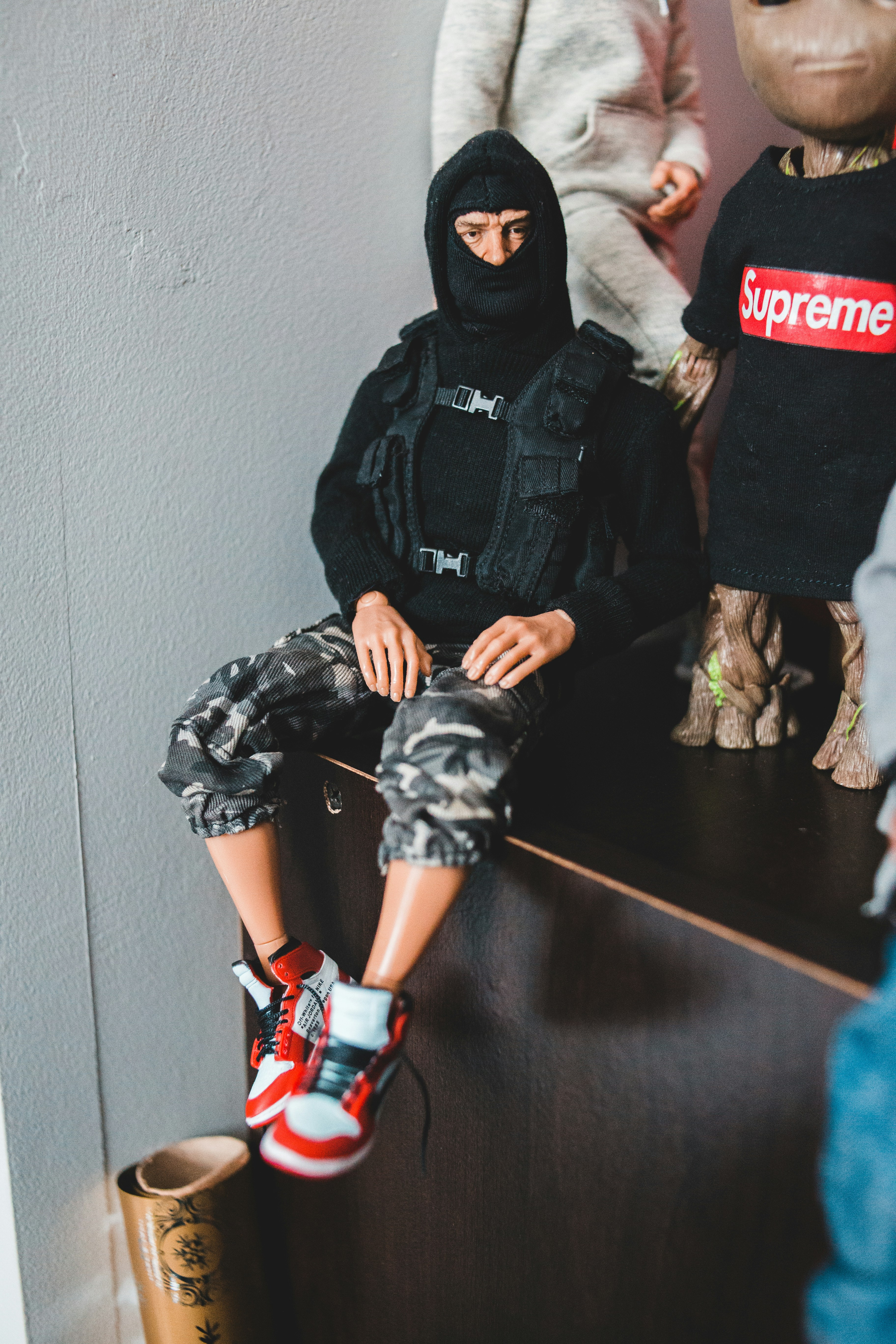 Balaclava-Agent on a Quiet Shelf: Streetwear Action Figures in Focus