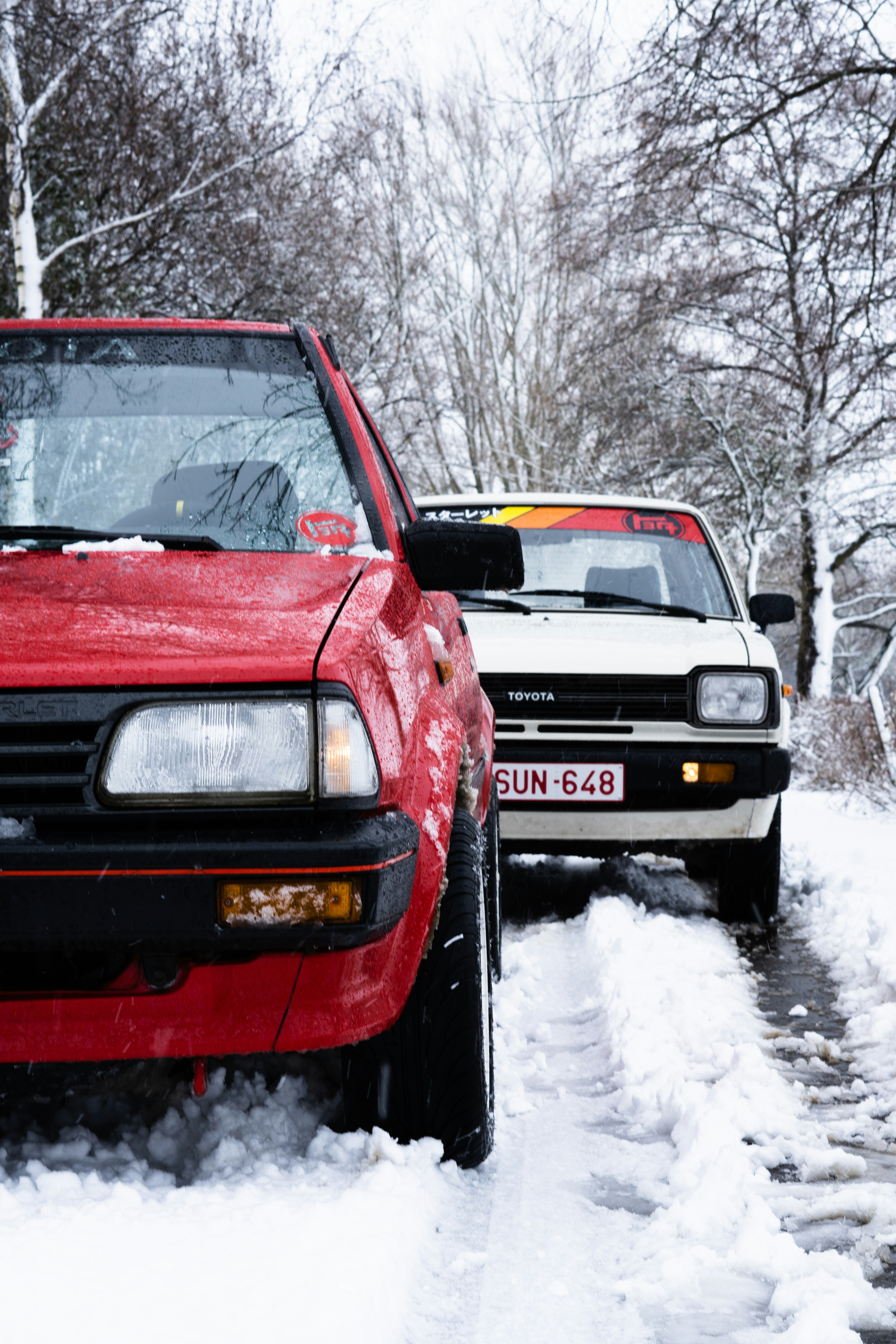 Red chevrolet car on snow covered road during daytime photo – Free ...