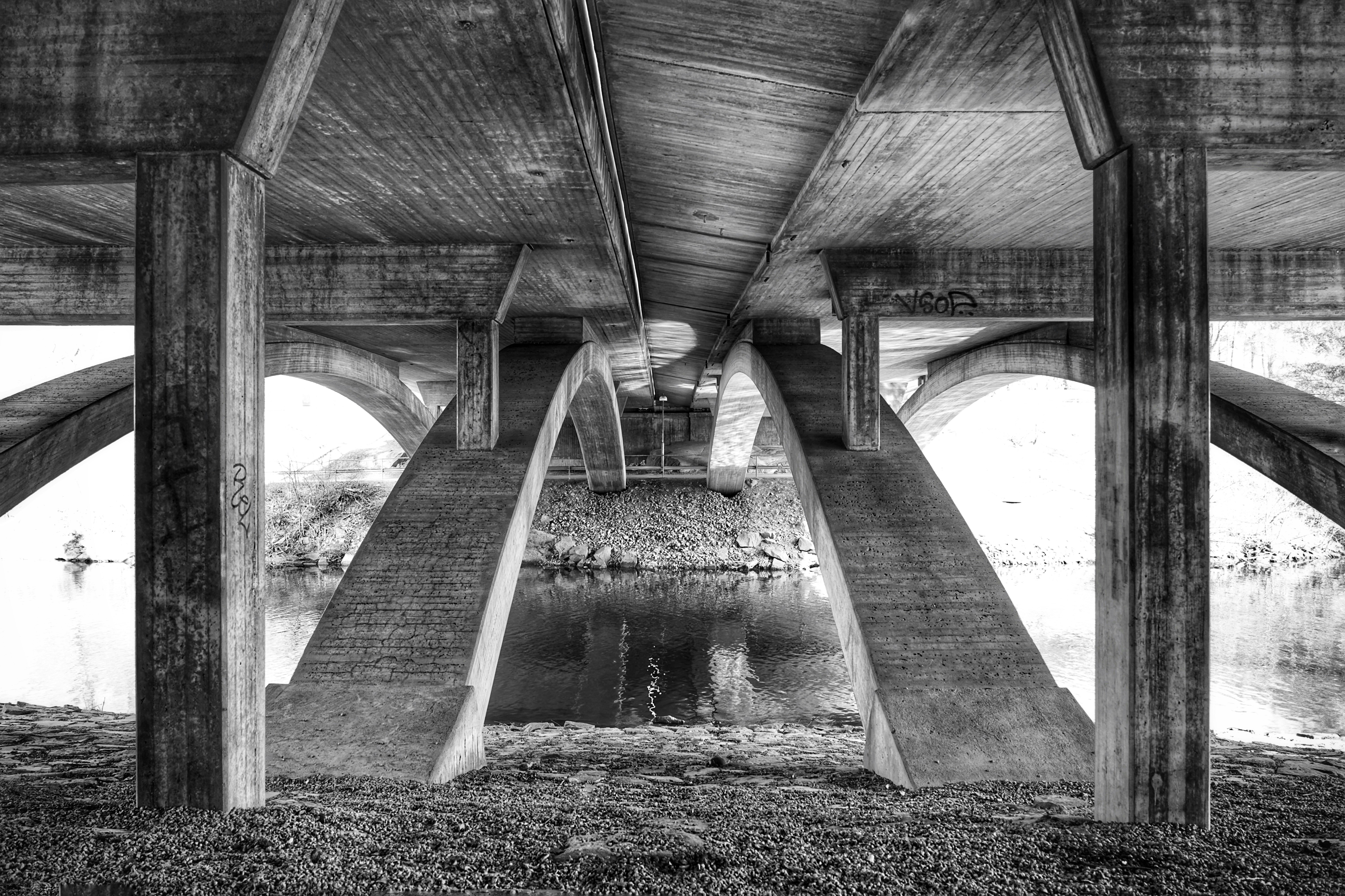 Grayscale photo of concrete bridge photo – Free Grey Image on Unsplash