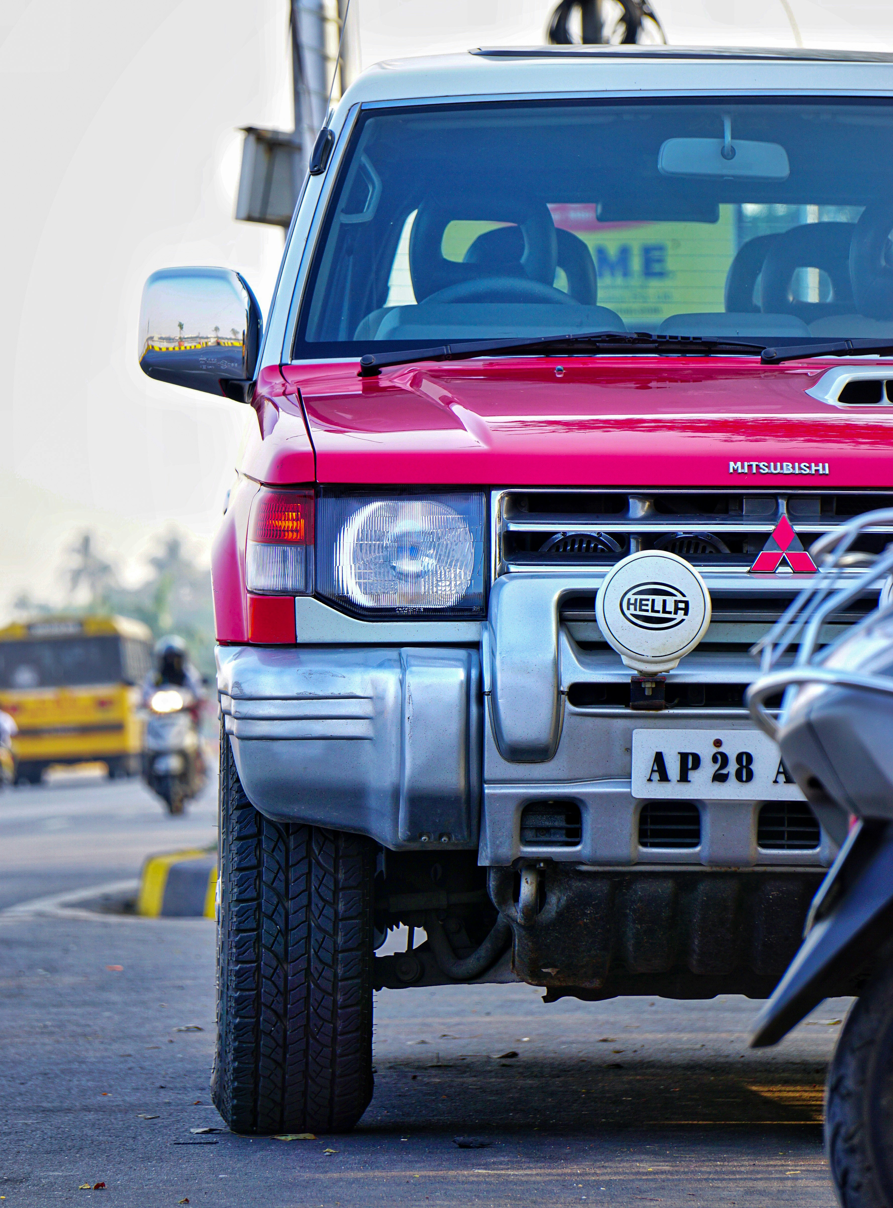 Front-Row Red: A Mitsubishi Pickup at the City Edge