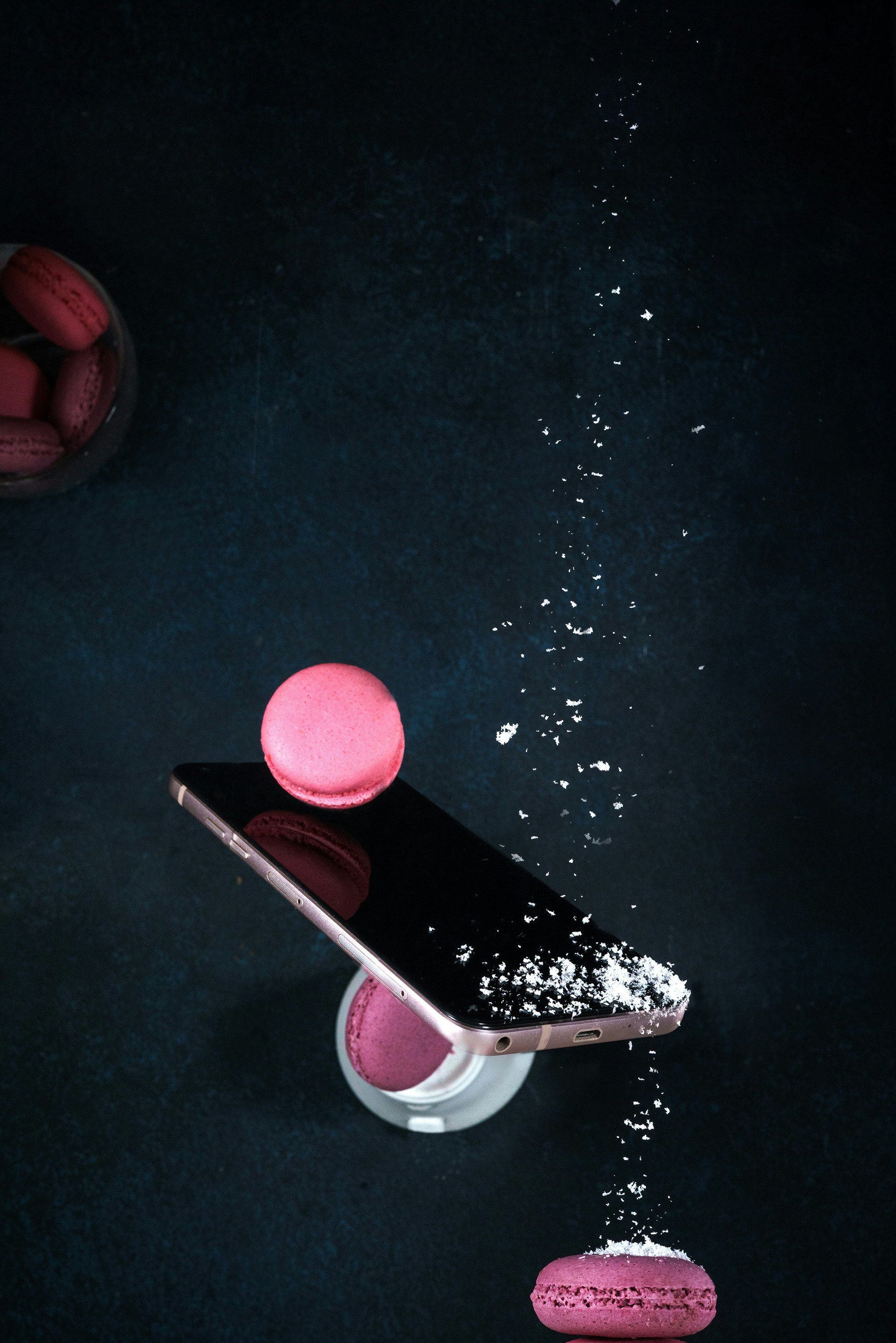 Pink Macaron Rendezvous on a Slate-Blue Surface