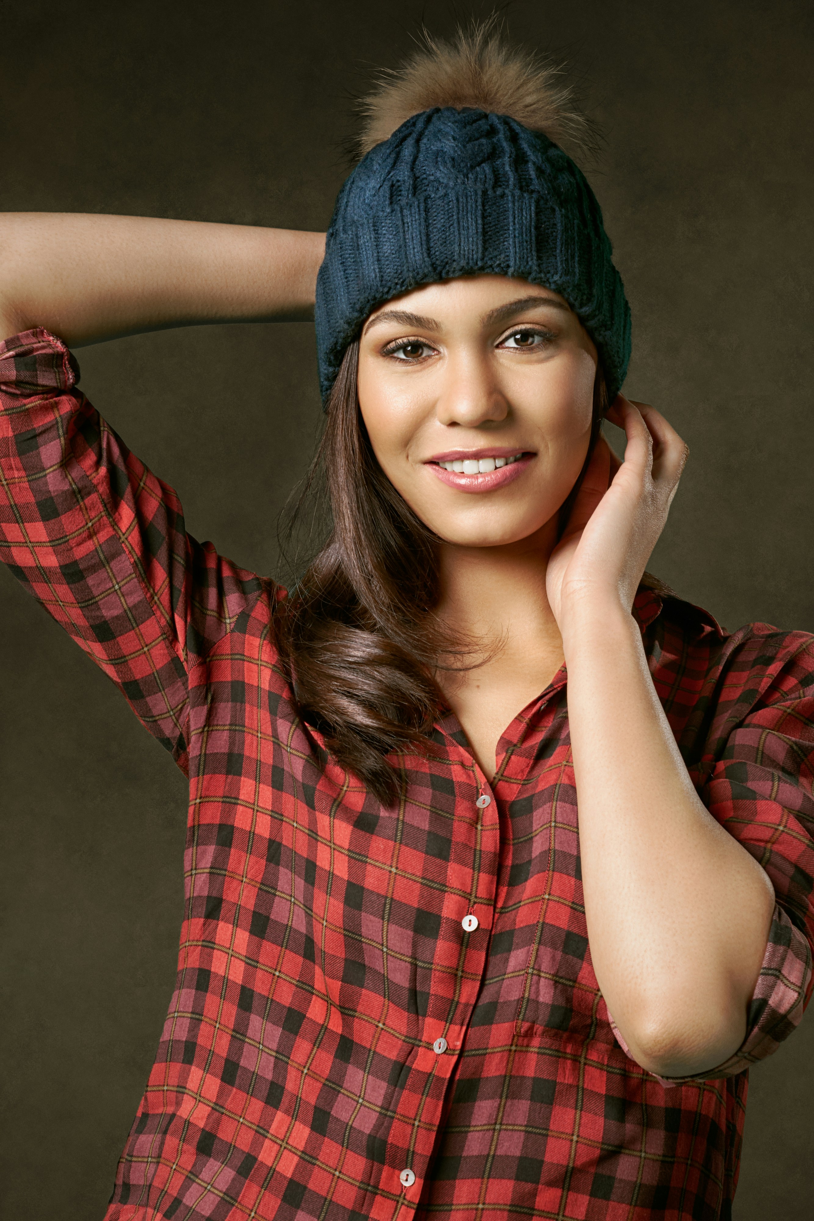 Winter Knit and Plaid: A Studio Portrait of Quiet Confidence