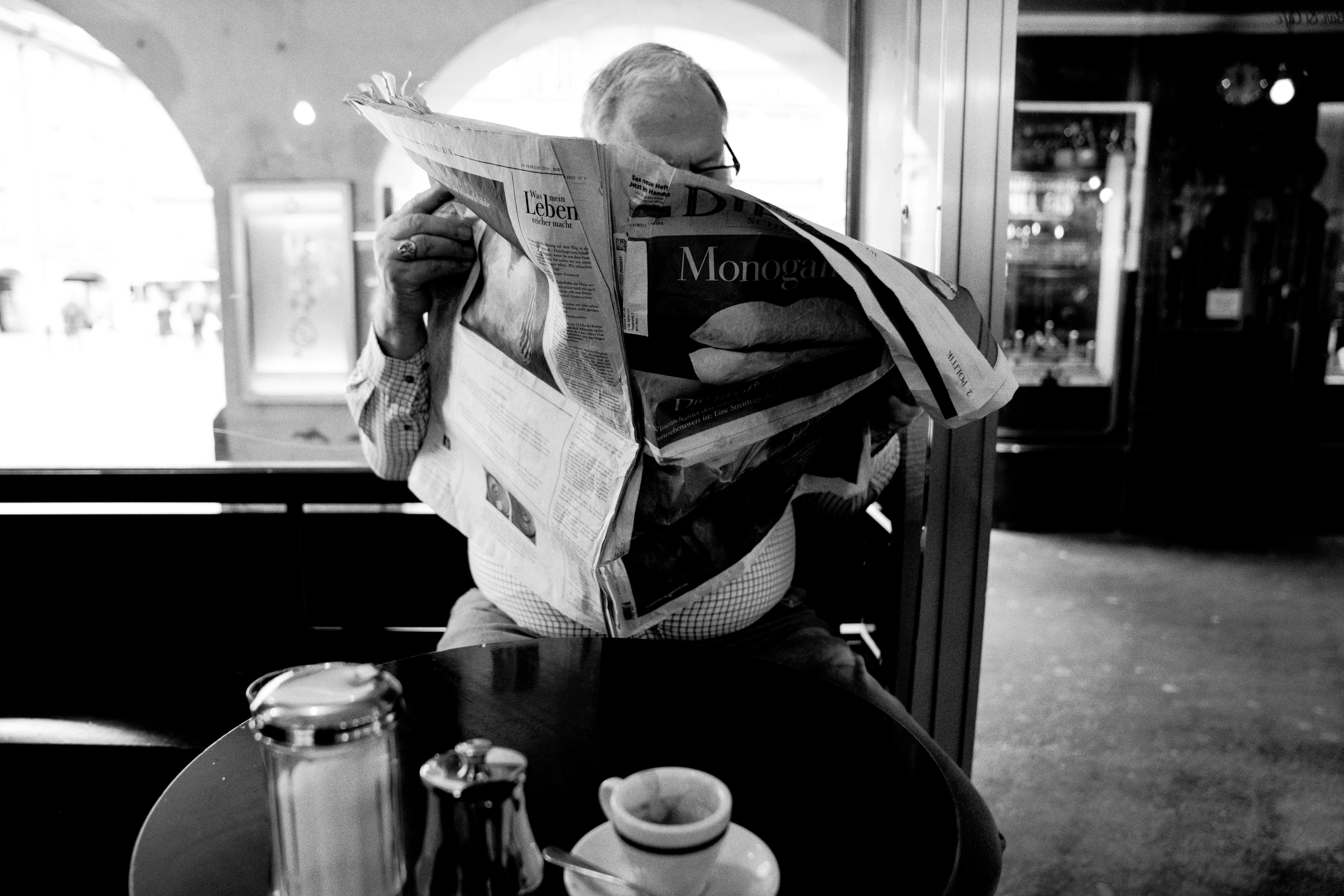 Grayscale photo of man reading newspaper photo – Free Grey Image on ...
