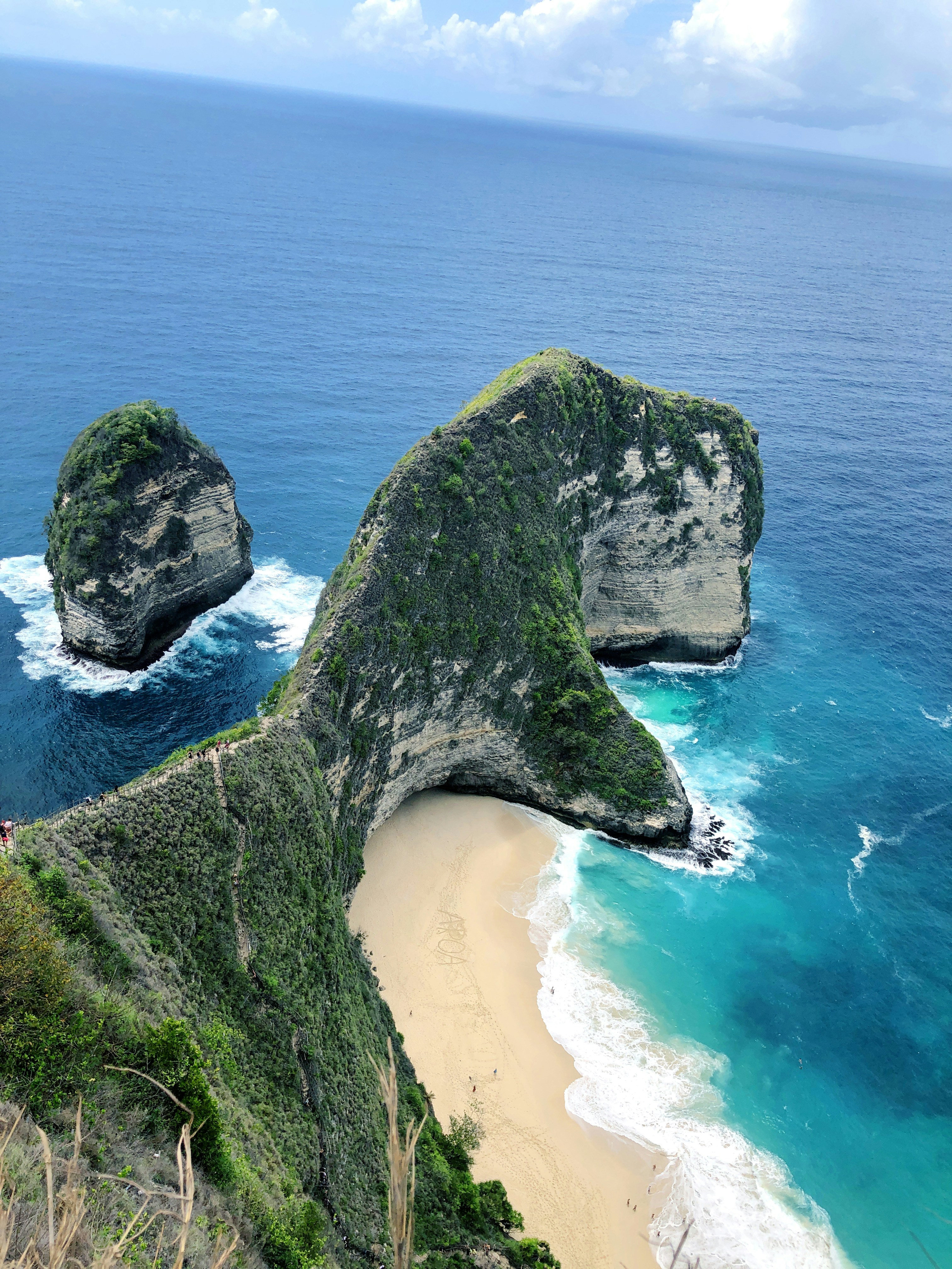 Green and black rock formation on seashore during daytime photo – Free ...