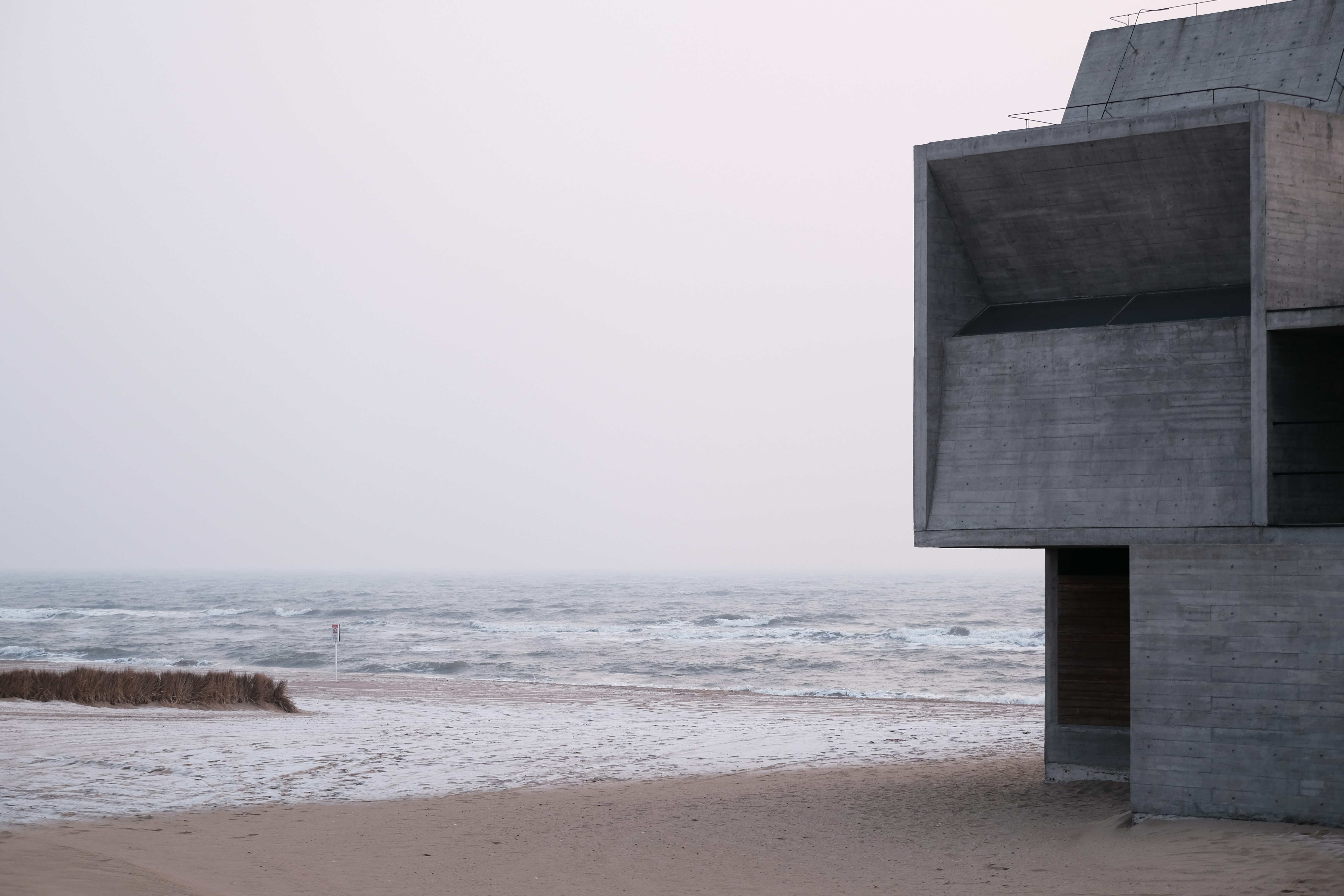 Gray concrete building on beach during daytime photo – Free Grey Image ...