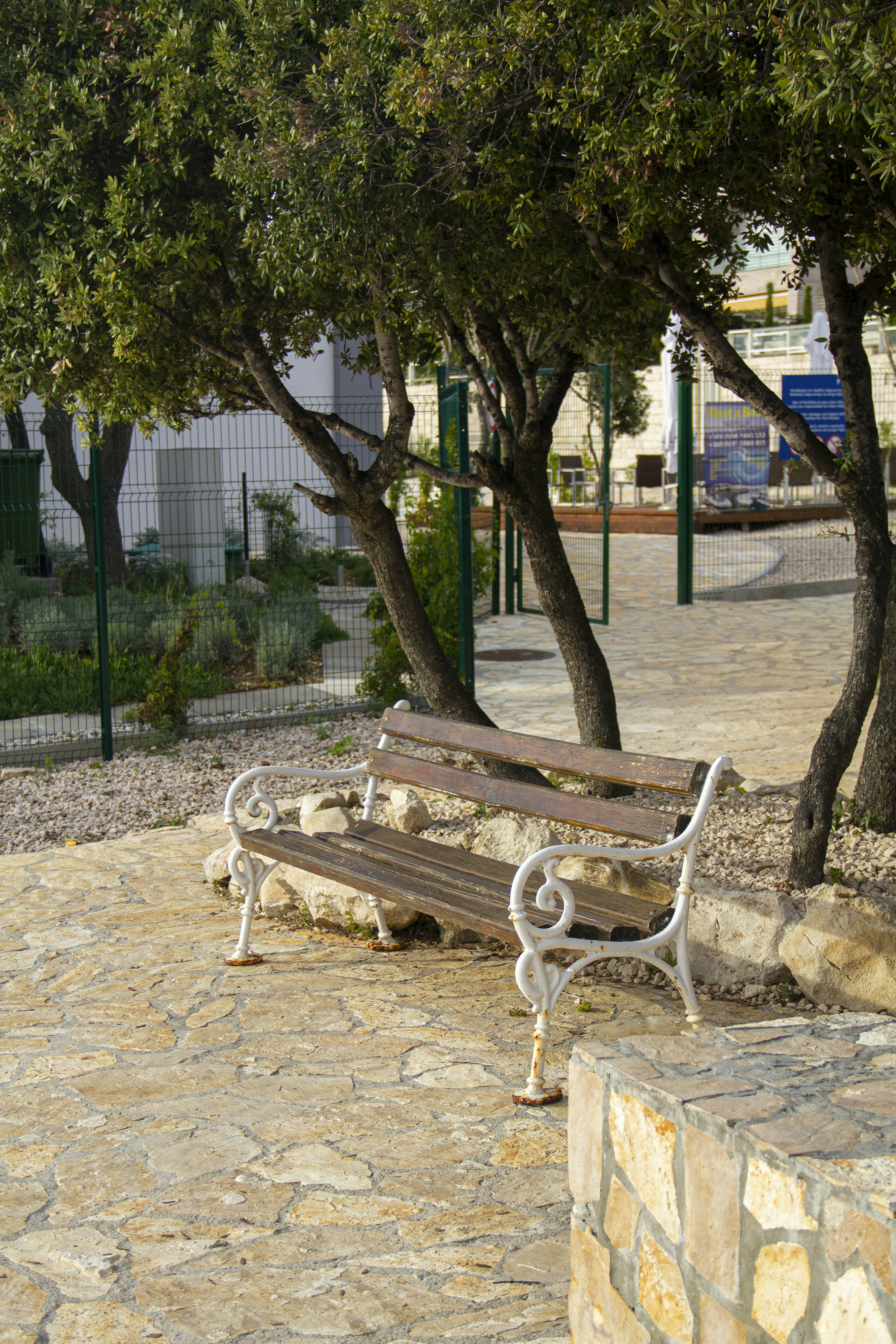 Rugged bench on a sidewalk in Zadar, Croatia.