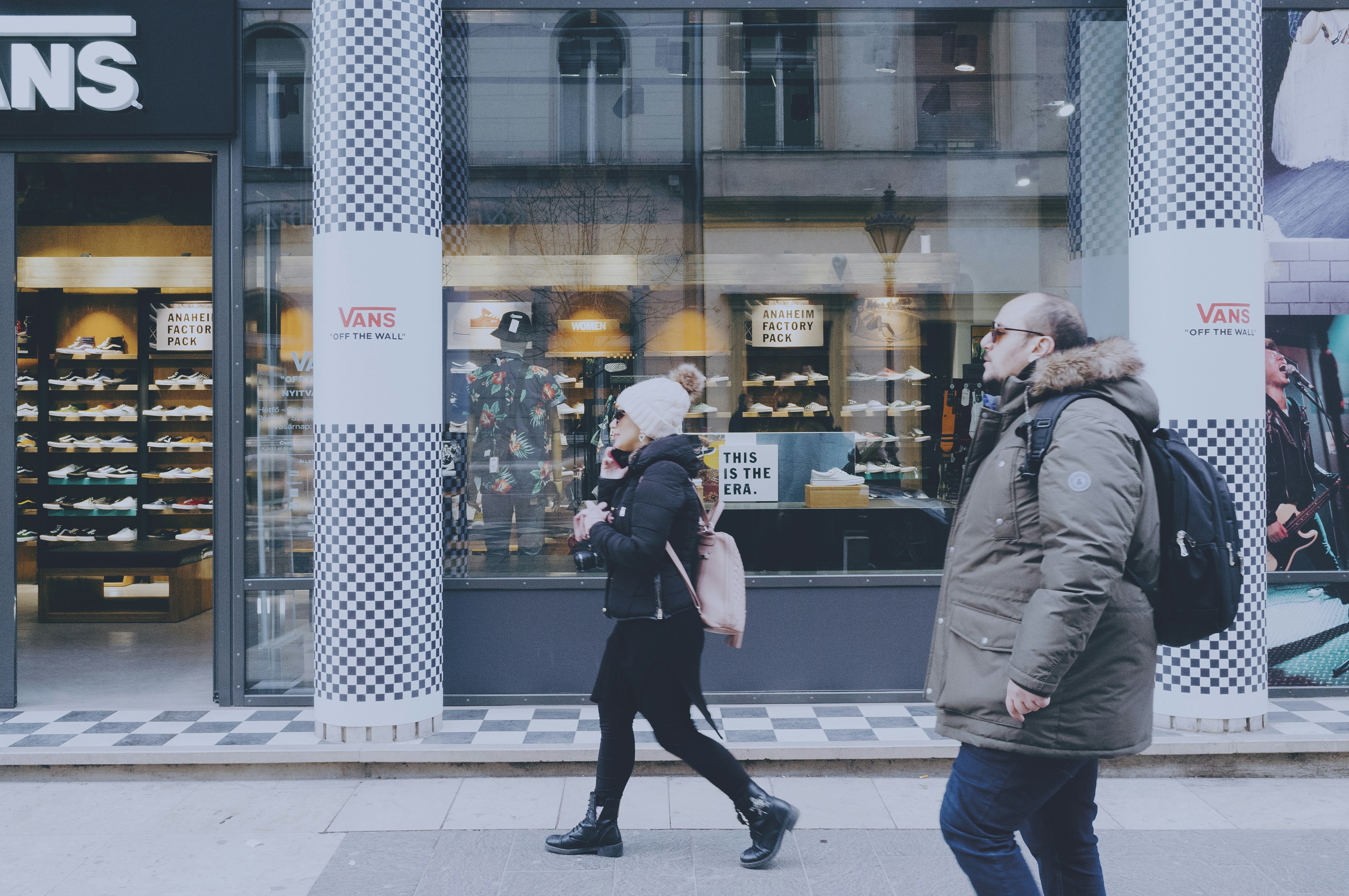 Midday Crossing: A Quiet Moment by the Vans Checkered Columns