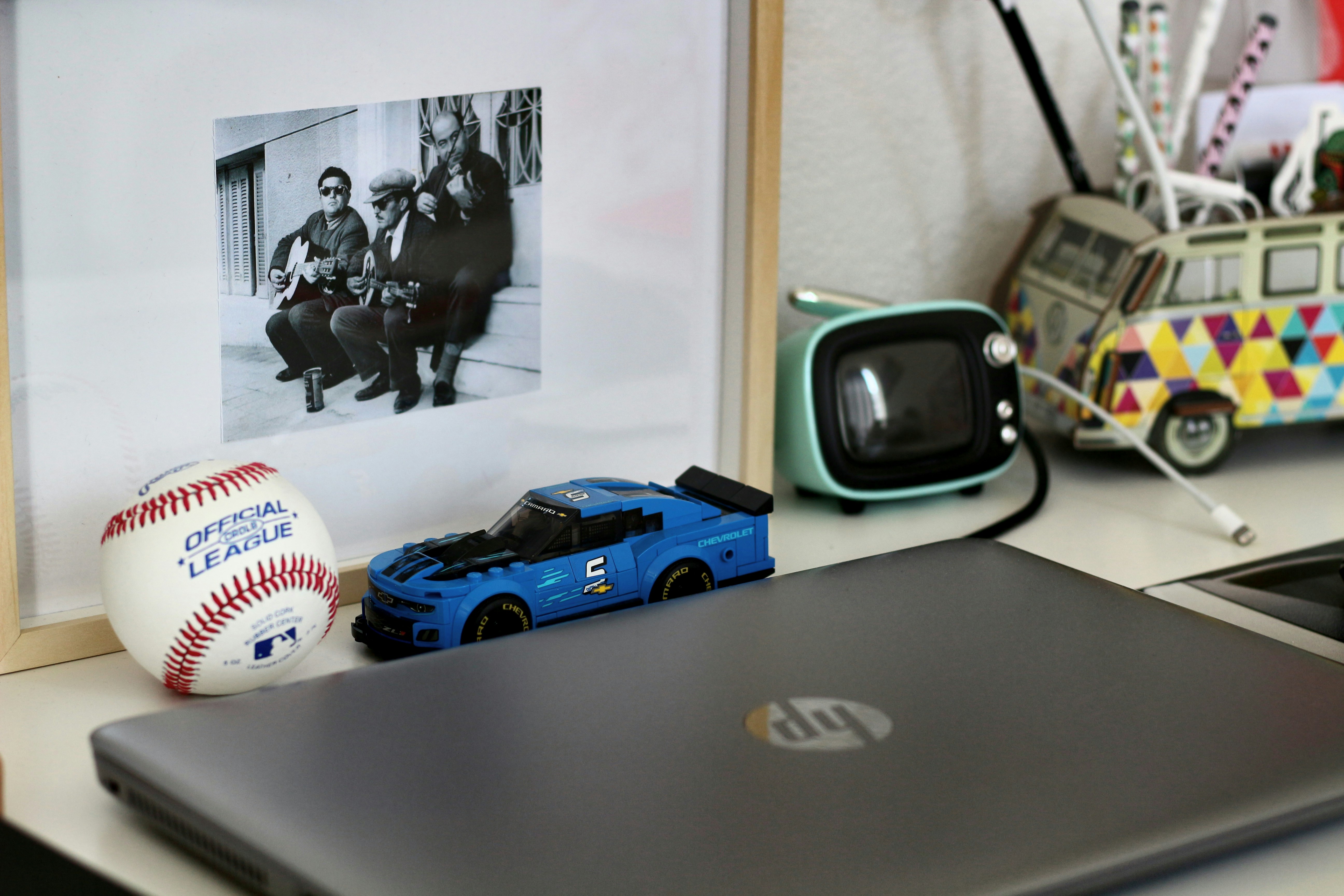 blue and black toy car on black table