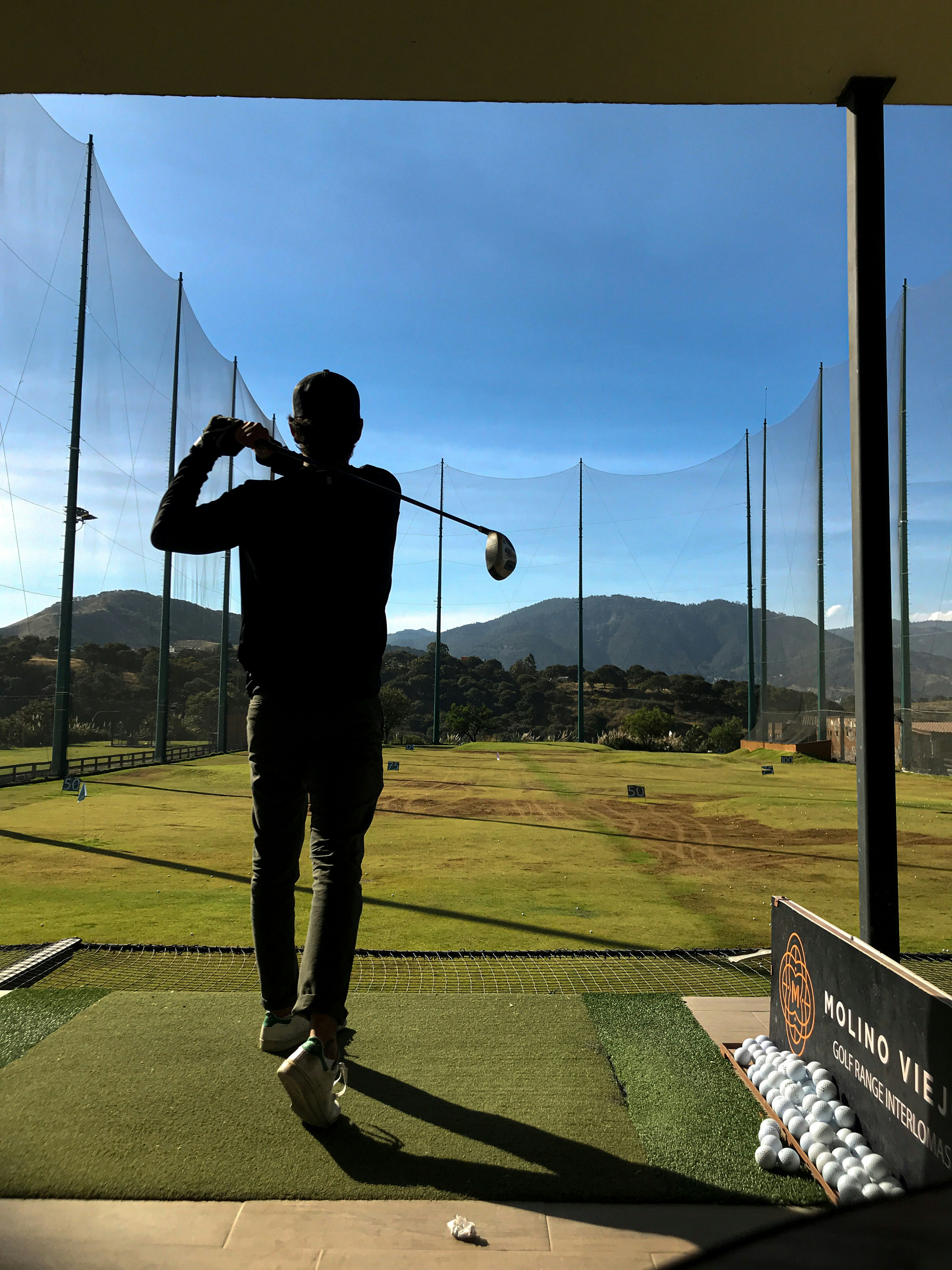 Man in black jacket and black pants standing on basketball court photo ...