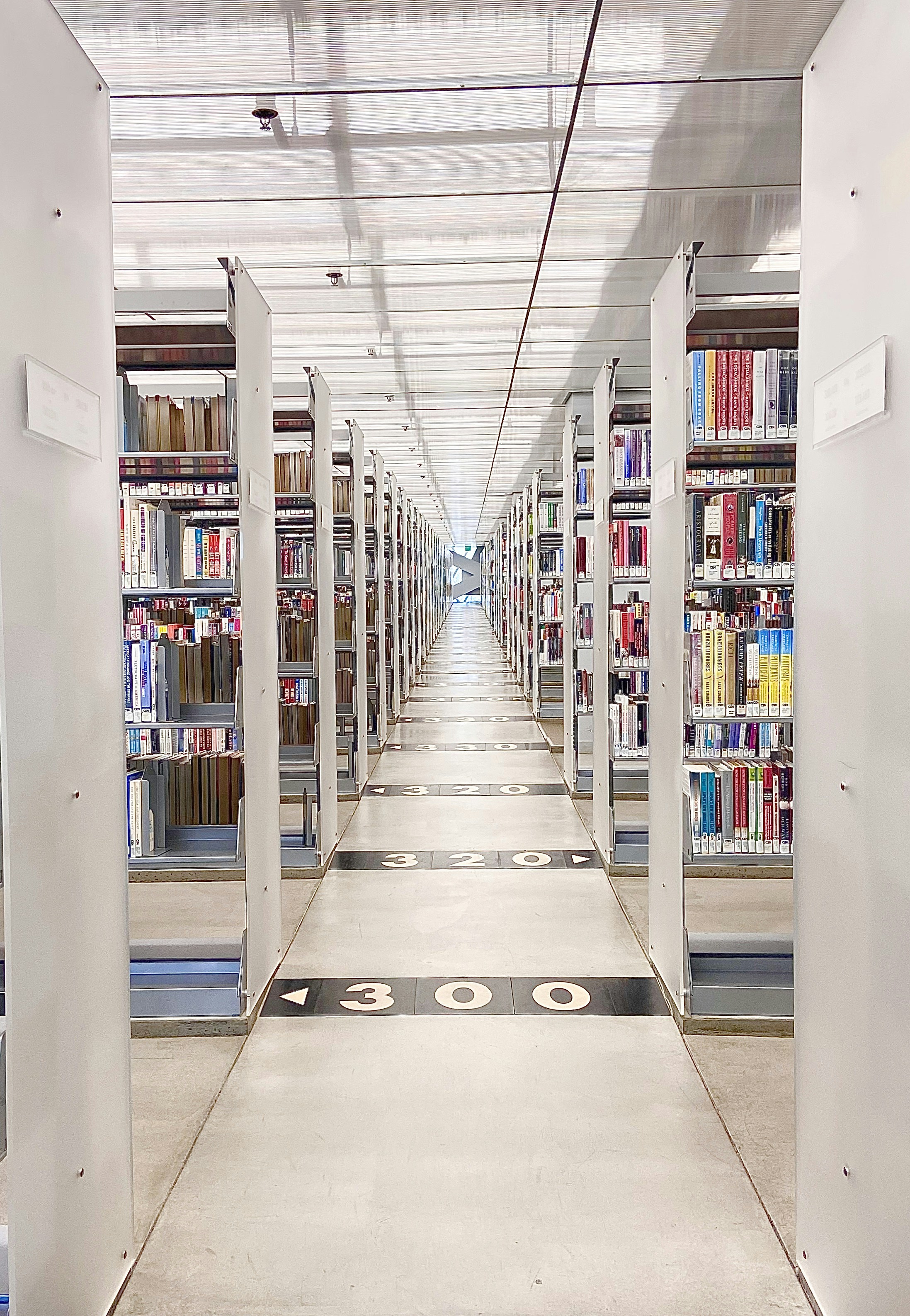 White and blue library hallway photo – Free Book Image on Unsplash