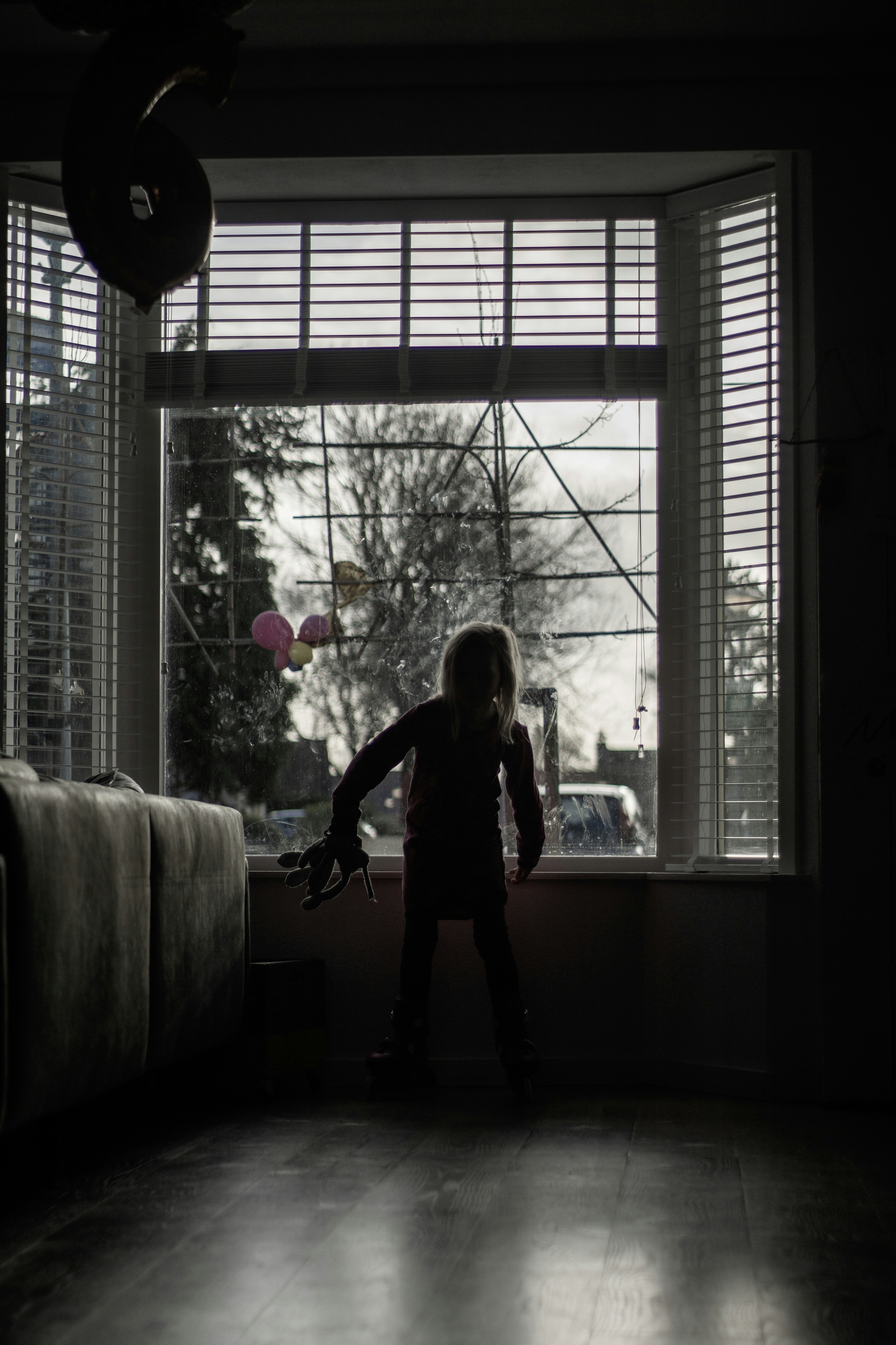 Backlit Silhouette in a Window-Framed Living Room