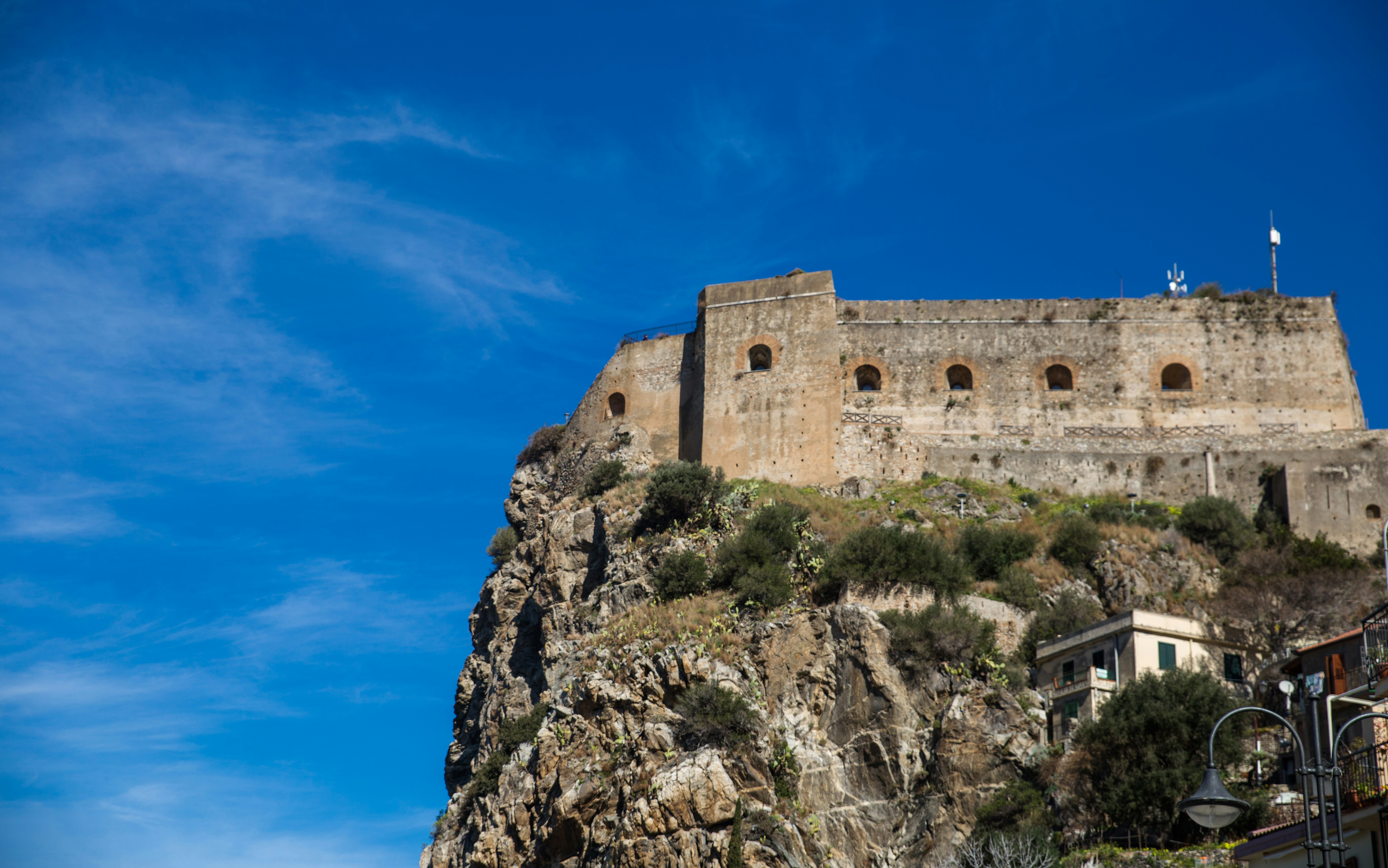 Brown concrete building on top of mountain during daytime photo – Free ...