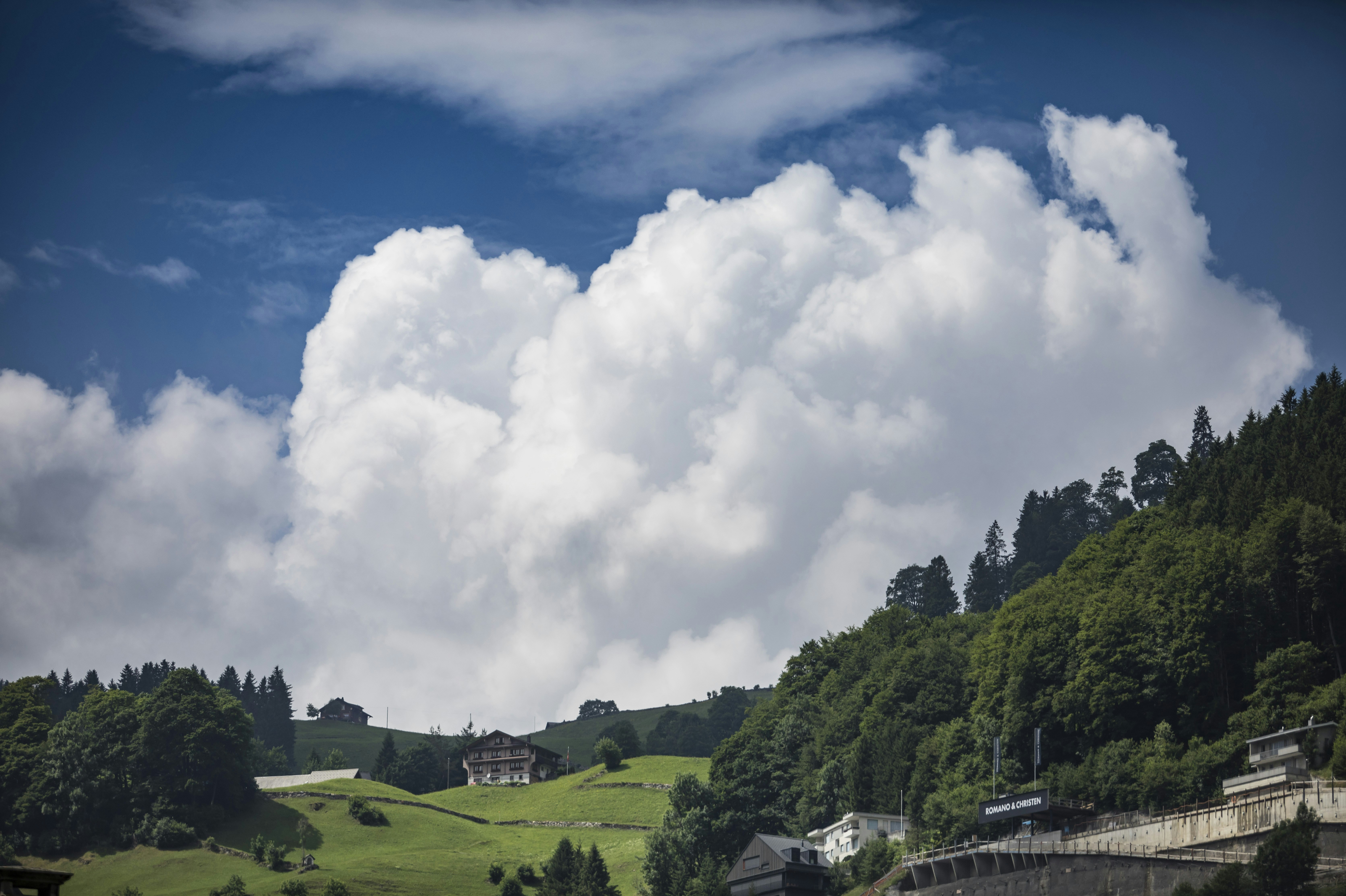 Cumulus Cathedral Above a Quiet Alpine Village