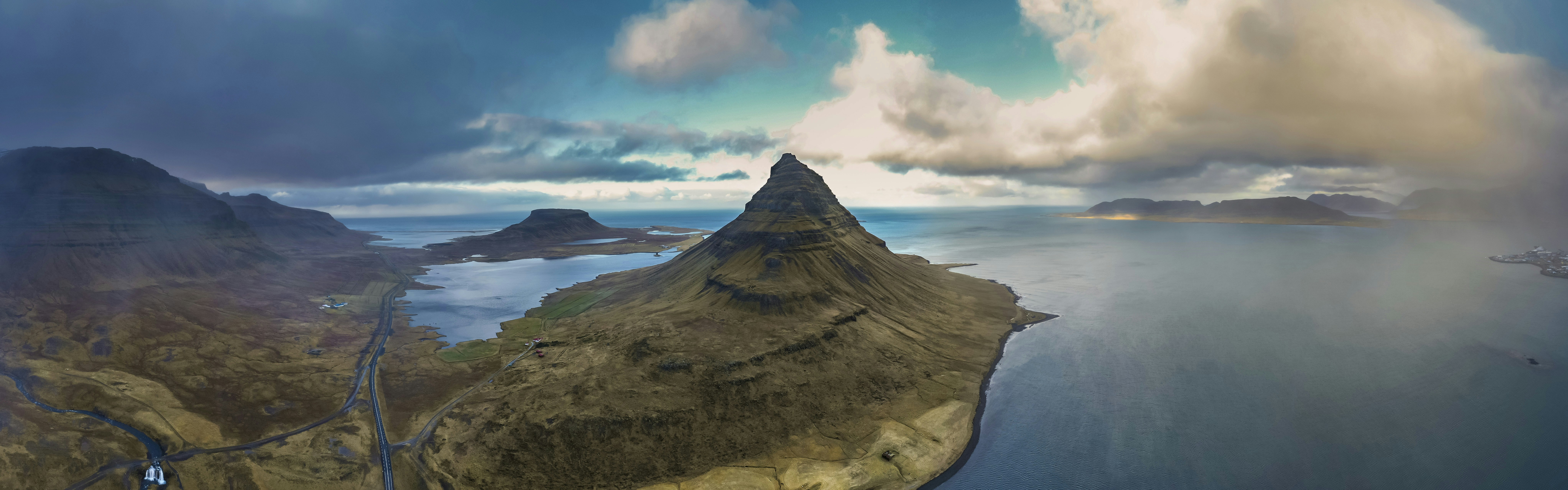 Peak in the Fjord: A Sea-Ringed Isle under shifting skies