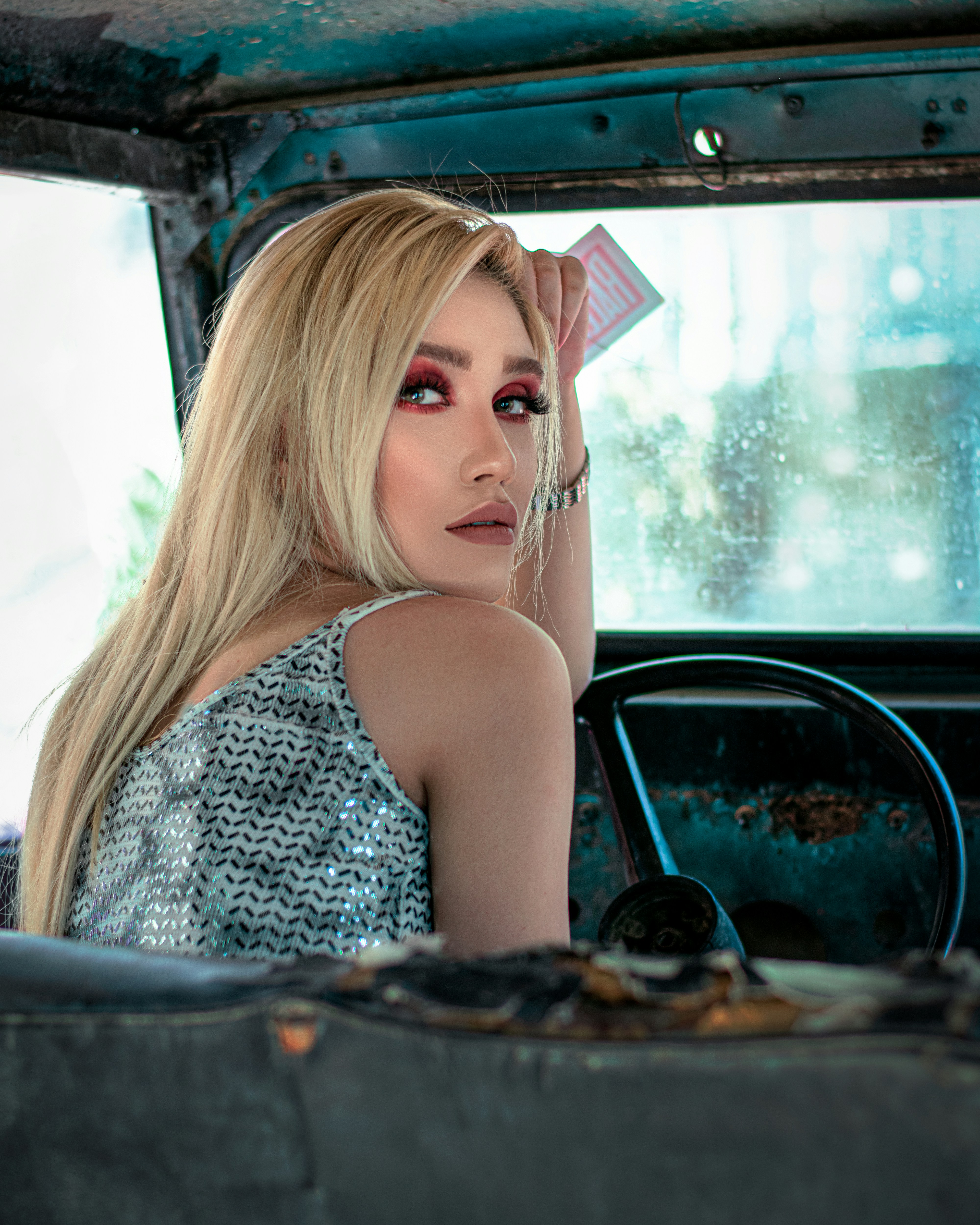 Woman in black and white tank top sitting on car seat photo – Free Iran ...