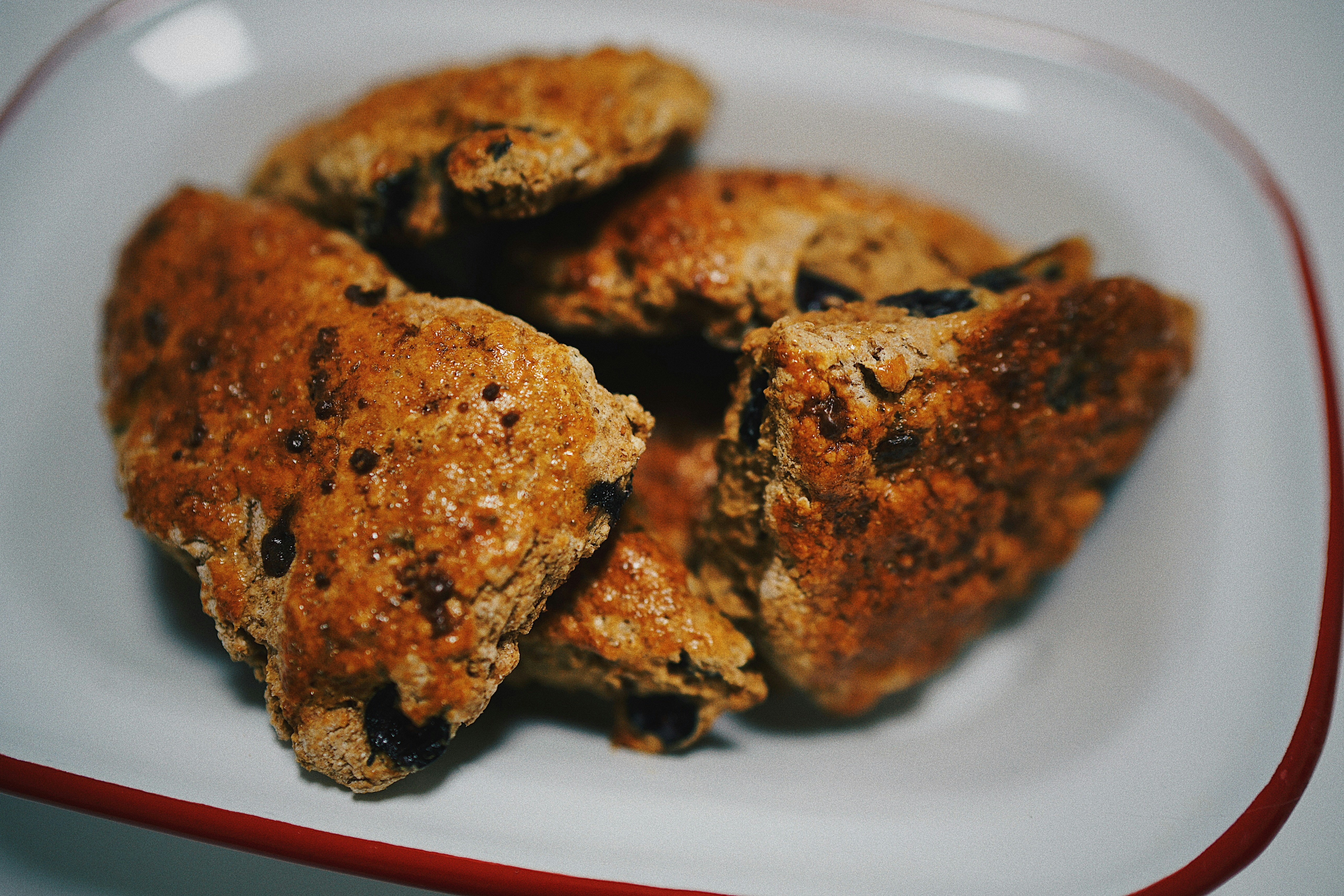 Golden Oatmeal Raisin Clusters in a Red-Rimmed Dish