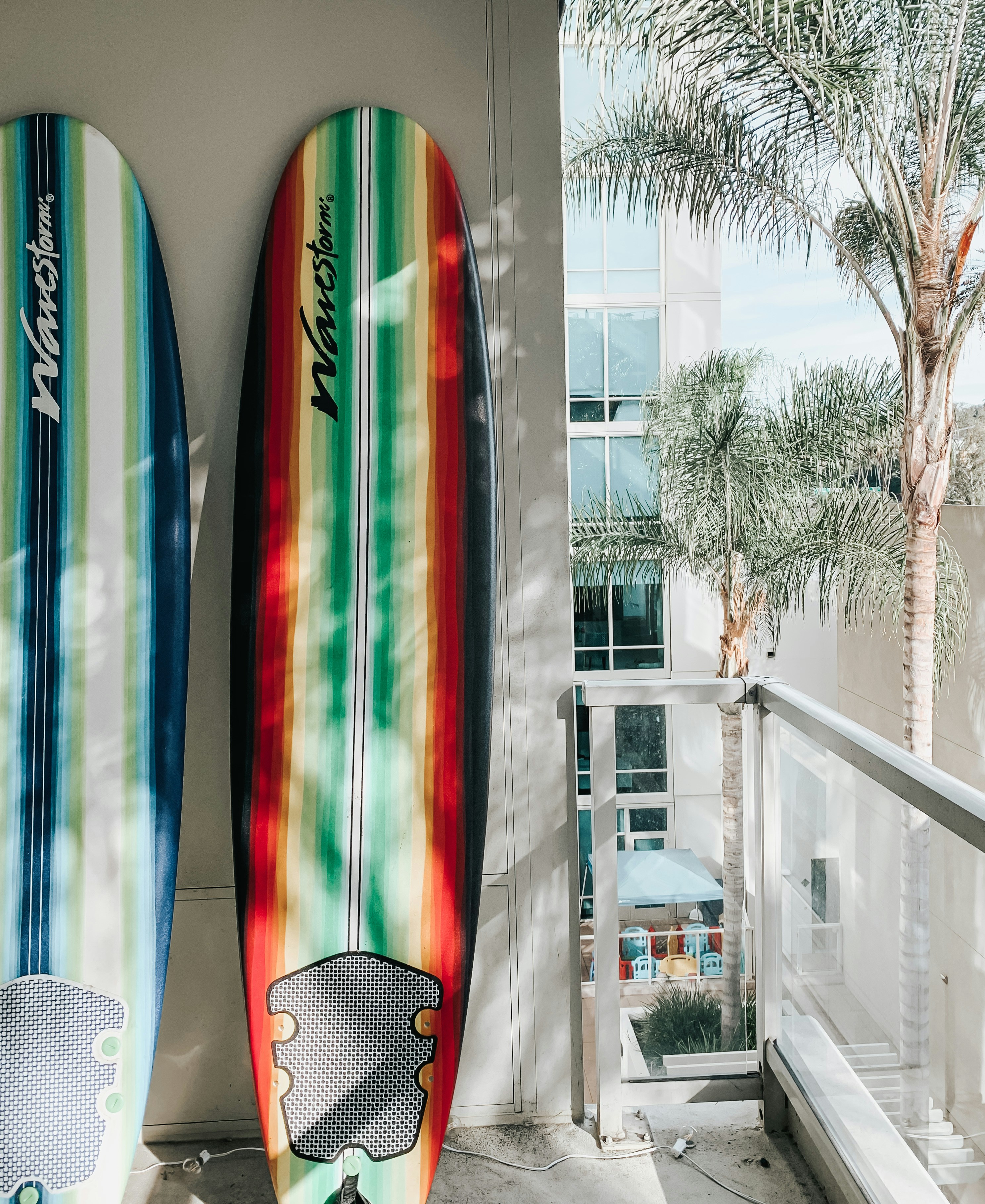 Red white and blue striped surfboard photo – Free Balcony Image on Unsplash