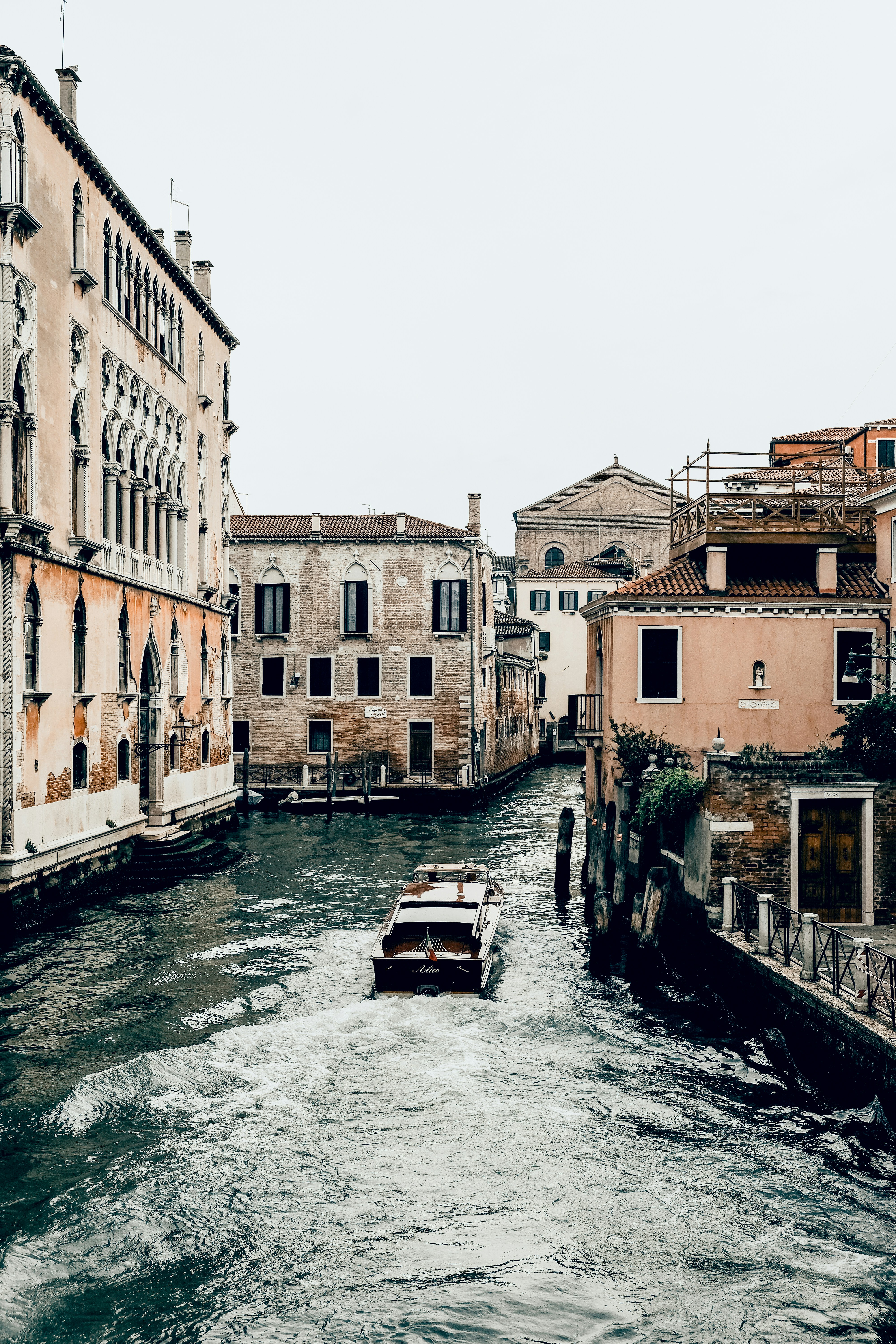 Boat on river between buildings during daytime photo – Free Outdoors ...