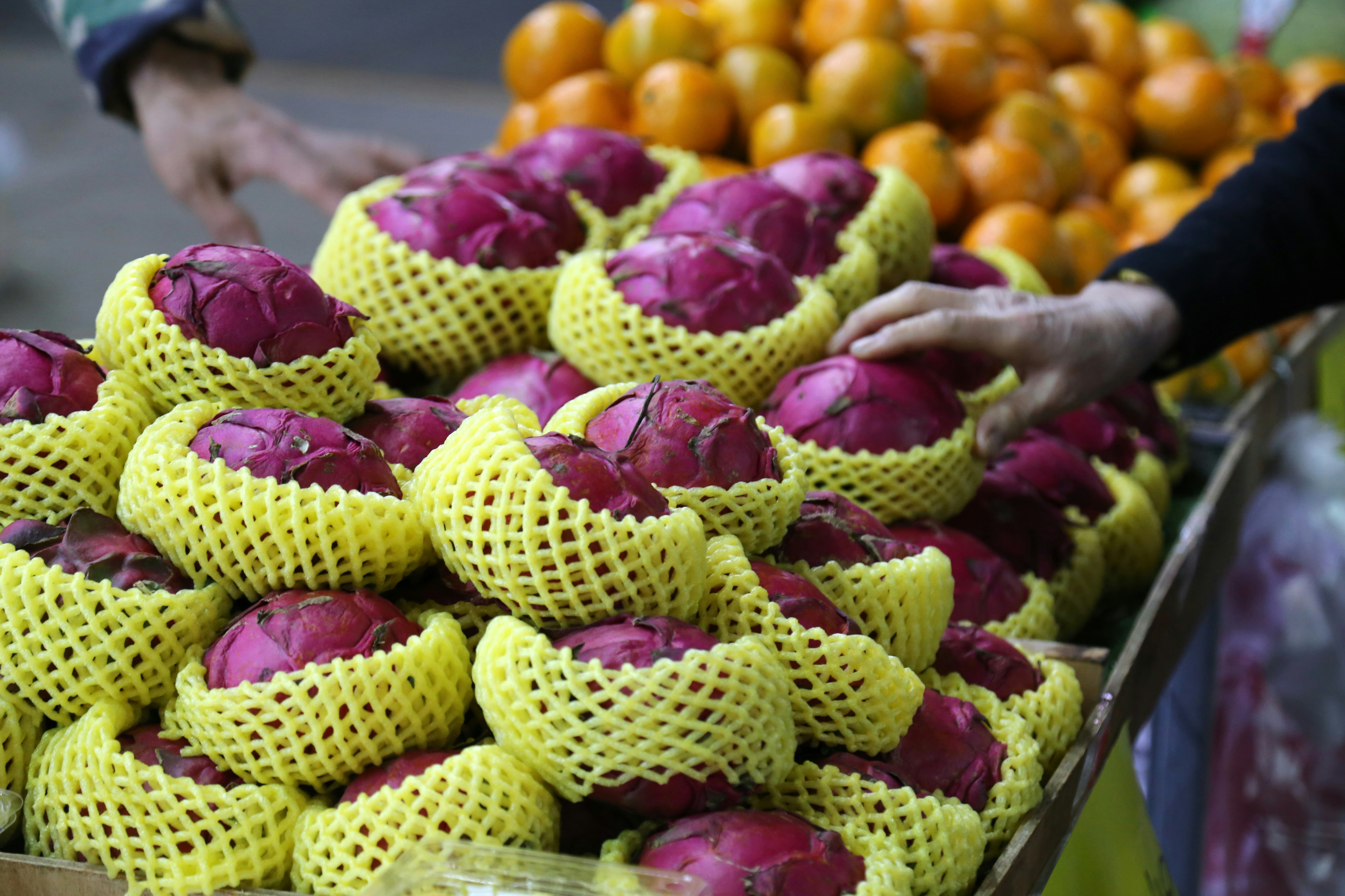 Vibrant Dragon Fruit Nest at a Street Market