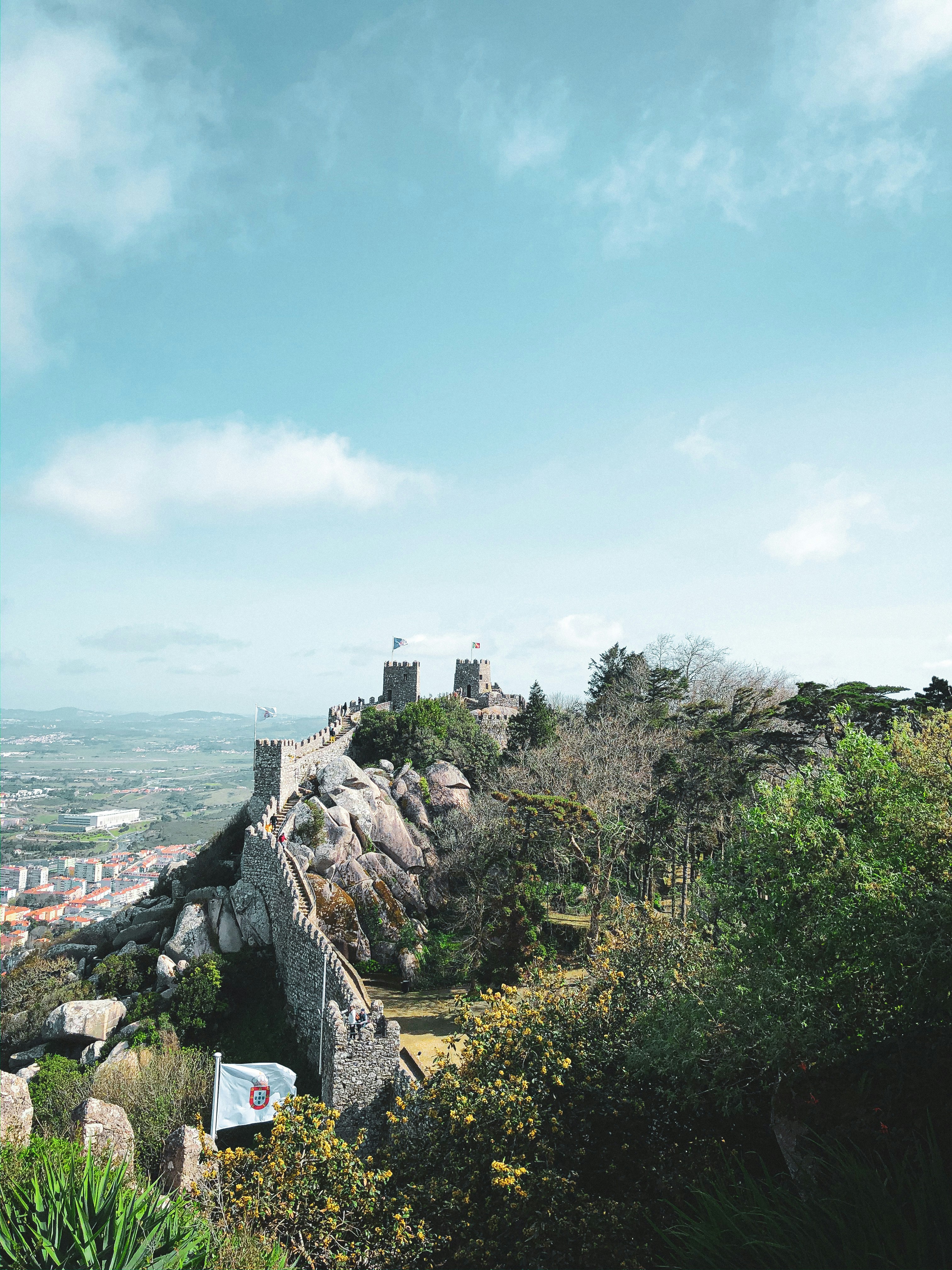 Castle on the Crest: Stone Sentinels Over a Green Valley