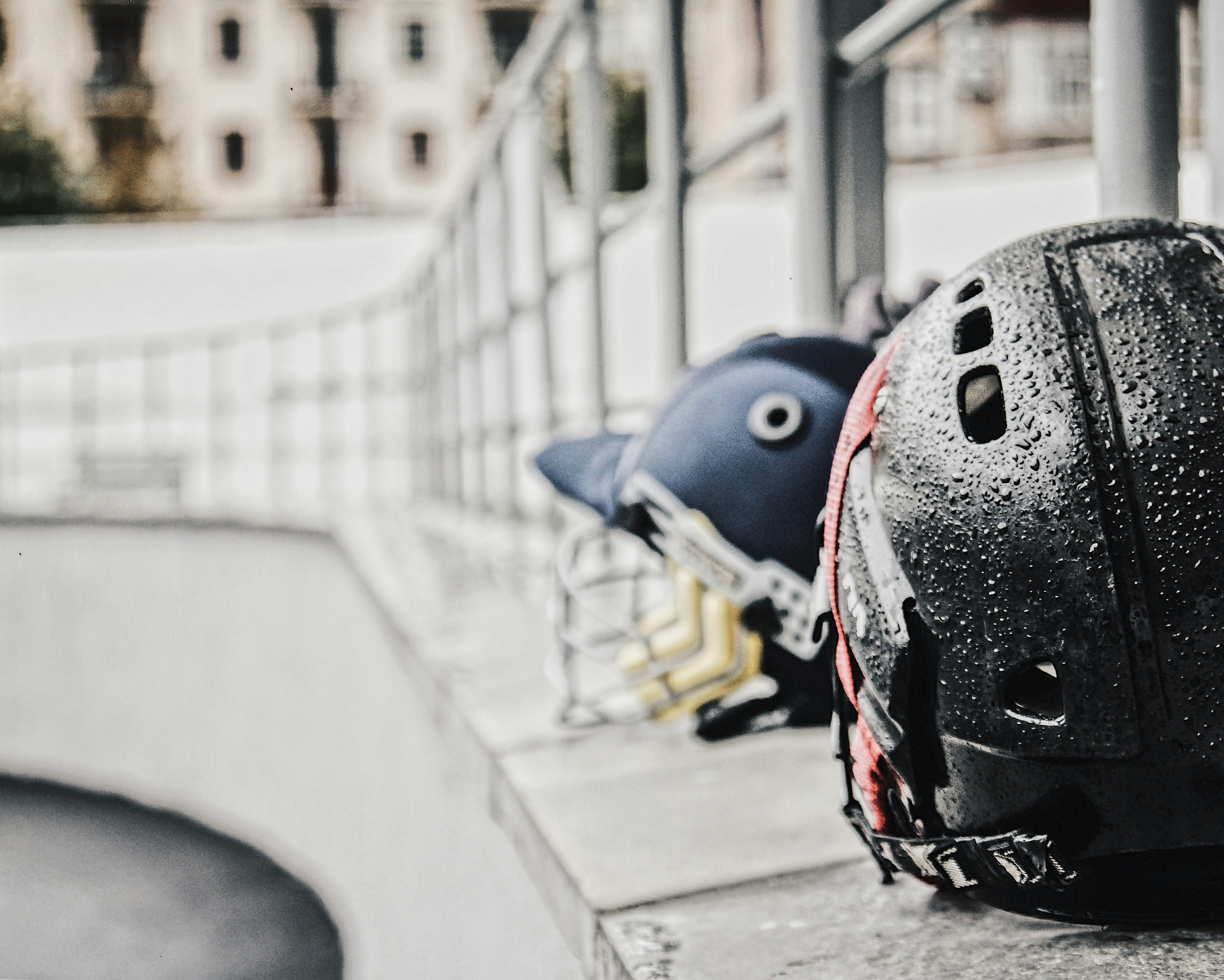 Rain-Kissed Rink: A Close-Up on the Droplet-Speckled Helmet