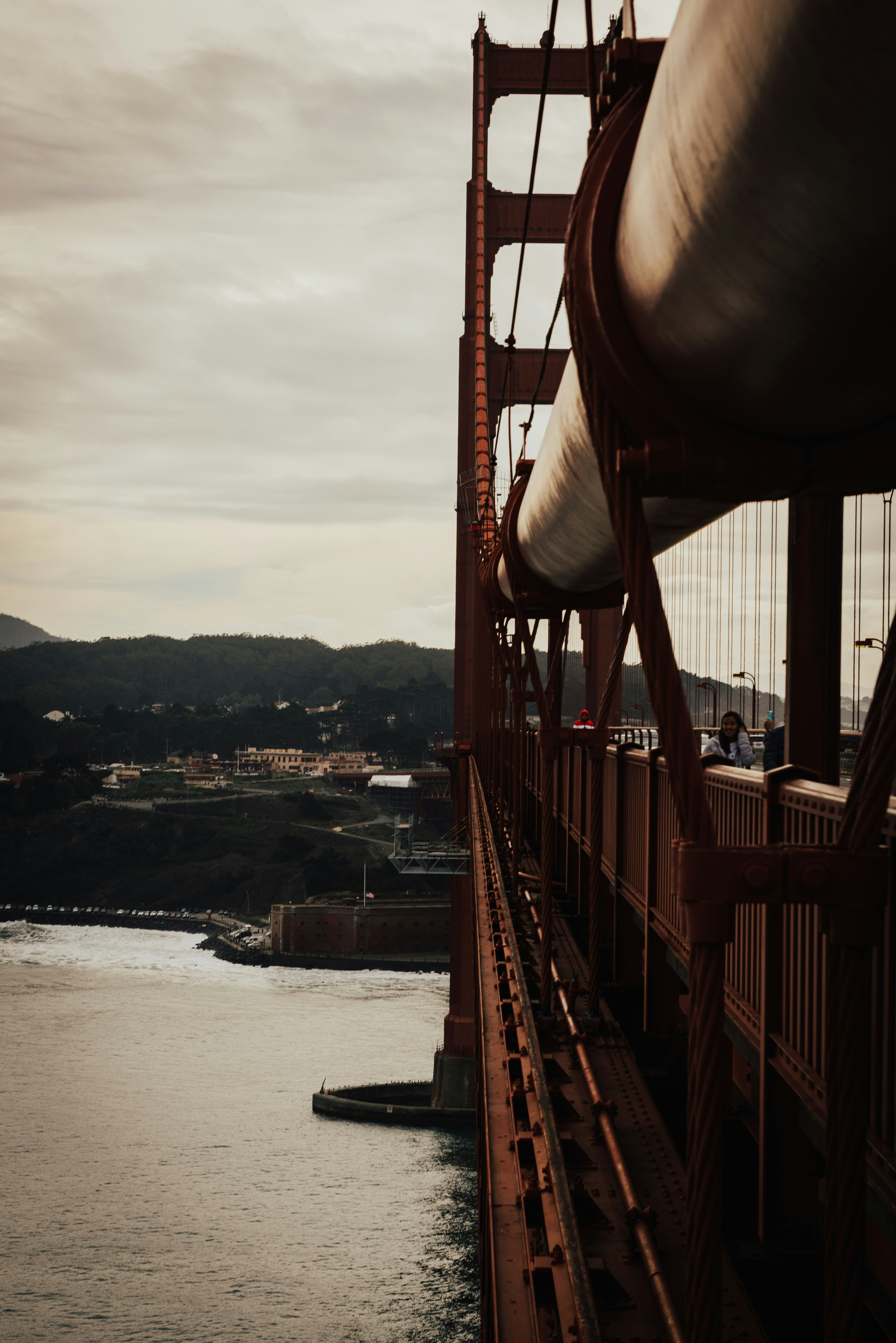 Red metal bridge over body of water during daytime photo – Free Grey ...