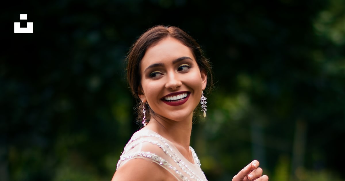 Woman In White Floral Dress Holding Bouquet Of Flowers Photo Free