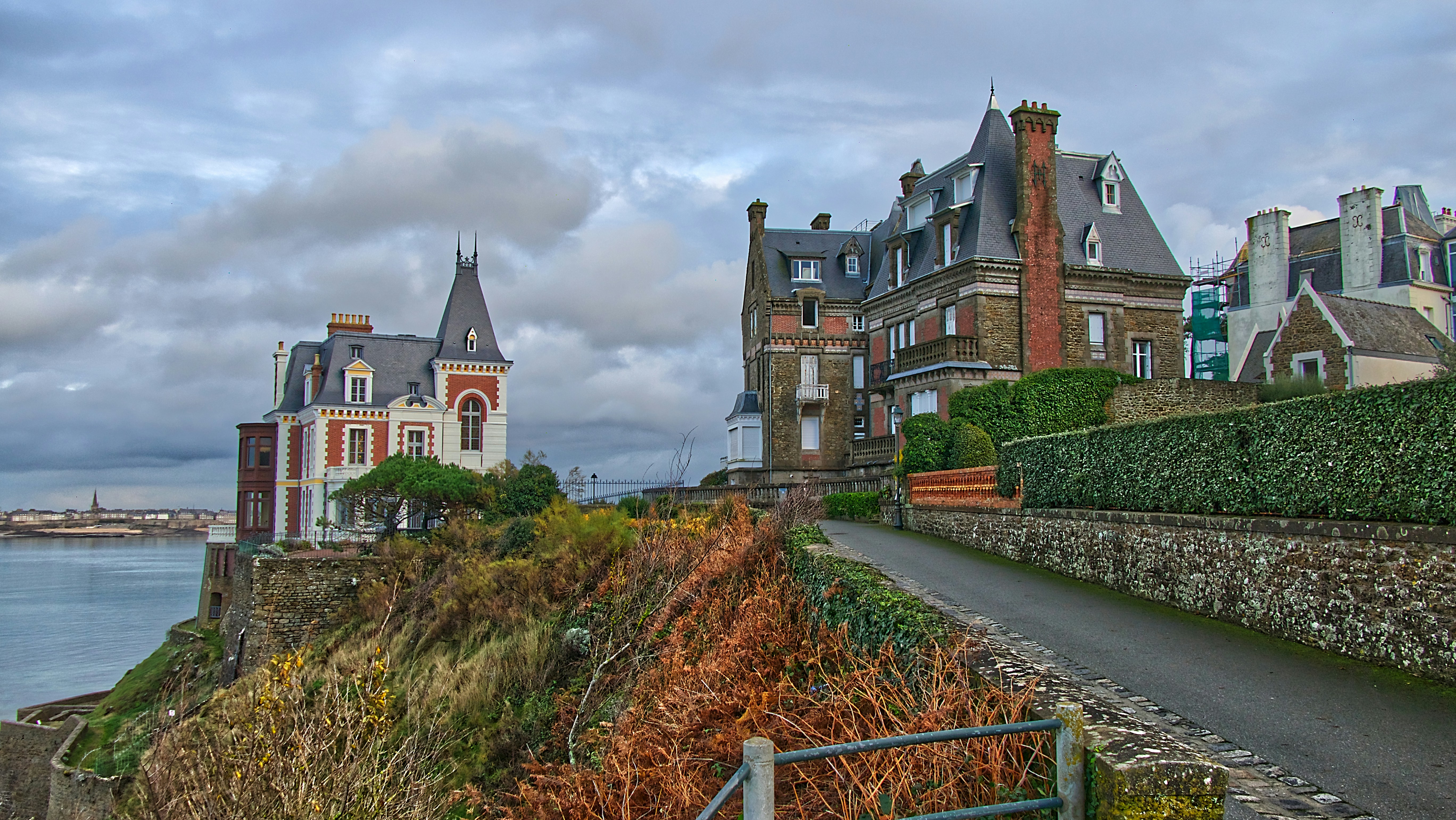 Crenellated Quiet: Seaside Lane Between Castle-like Houses and Atlantic Light