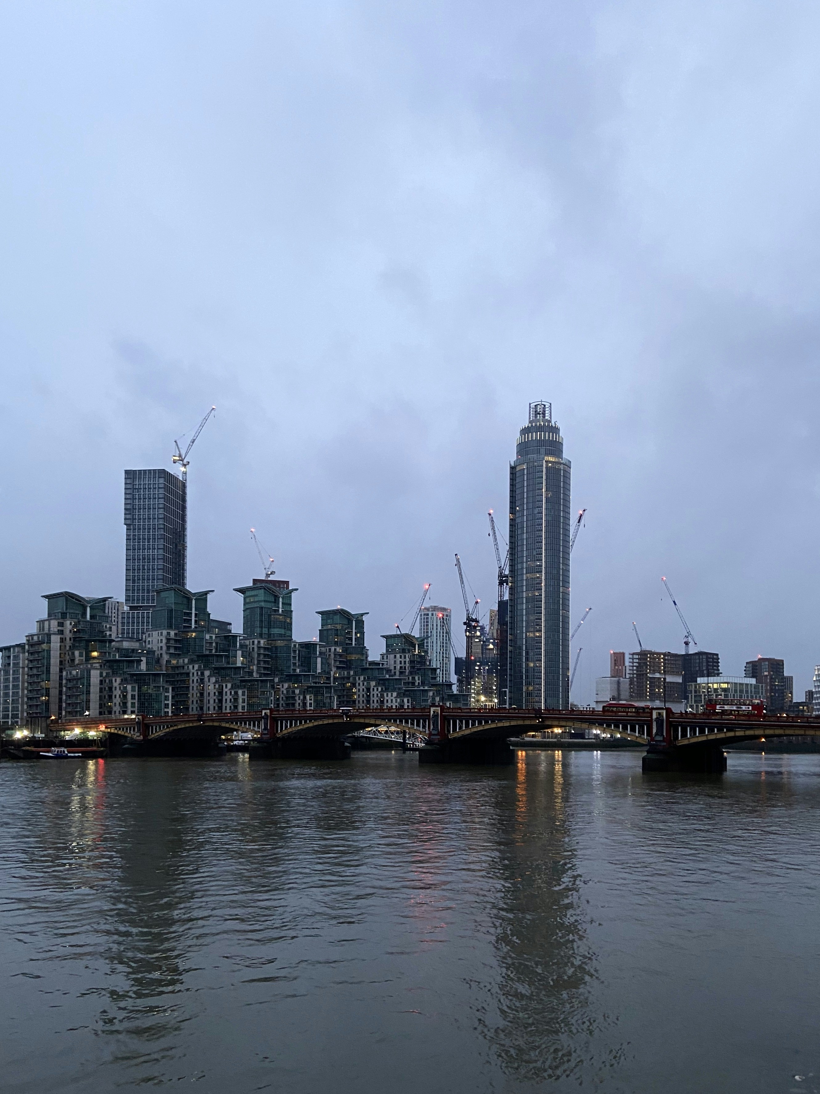 city skyline across body of water during daytime