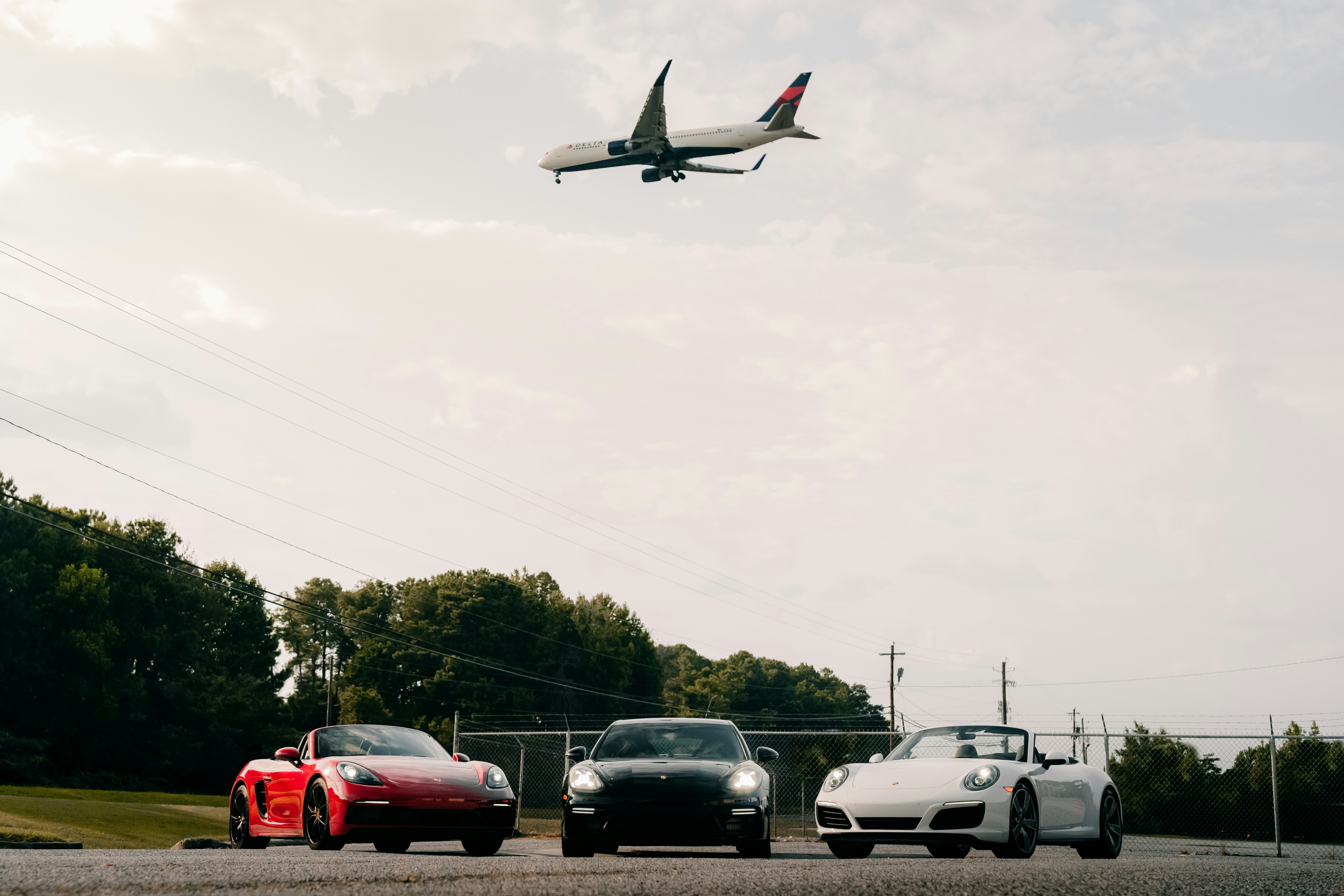 Red and white cars on road during daytime photo – Free Grey Image on ...