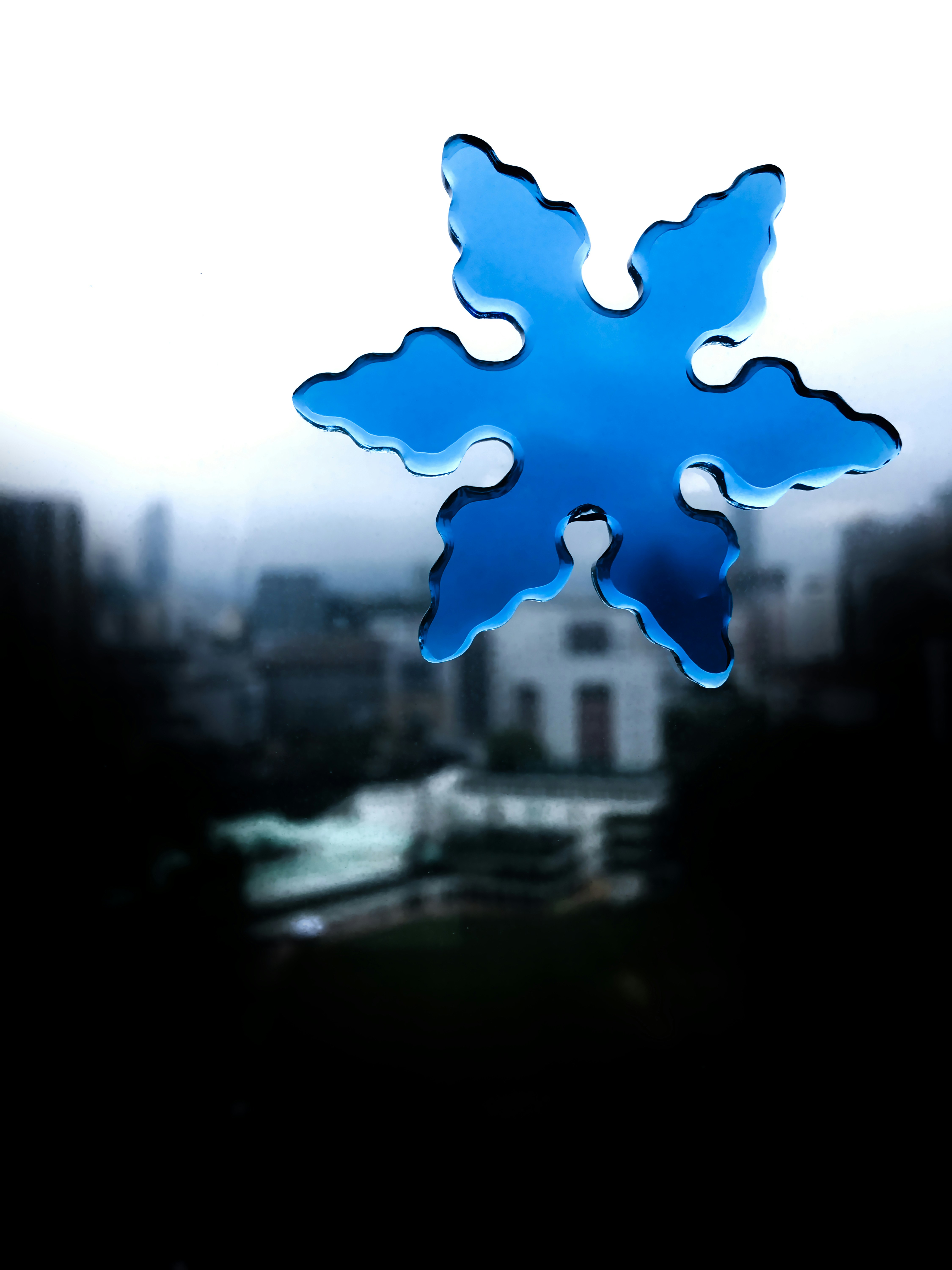 blue jigsaw puzzle piece on black surface
