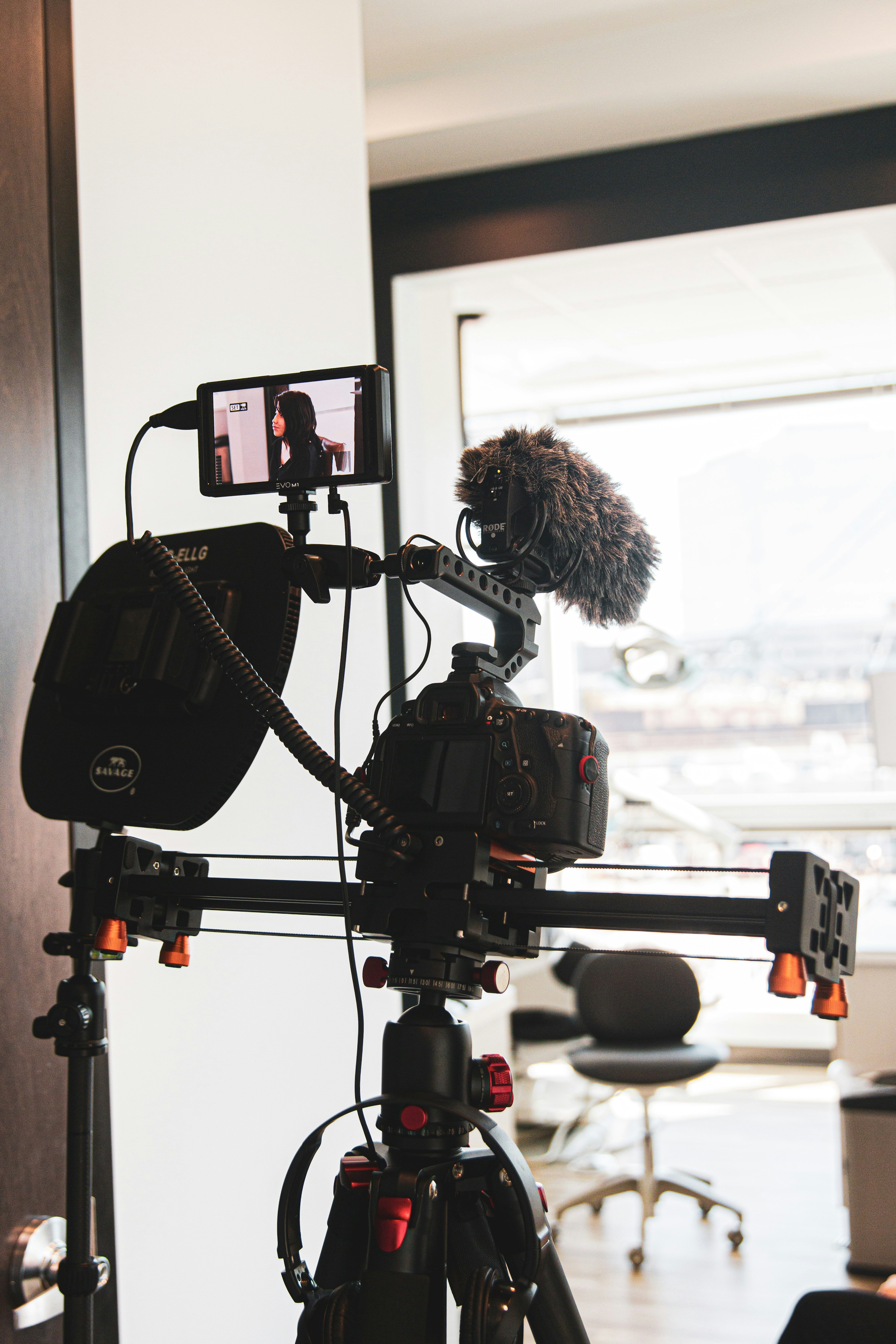 Black video camera on tripod photo – Free Human Image on Unsplash