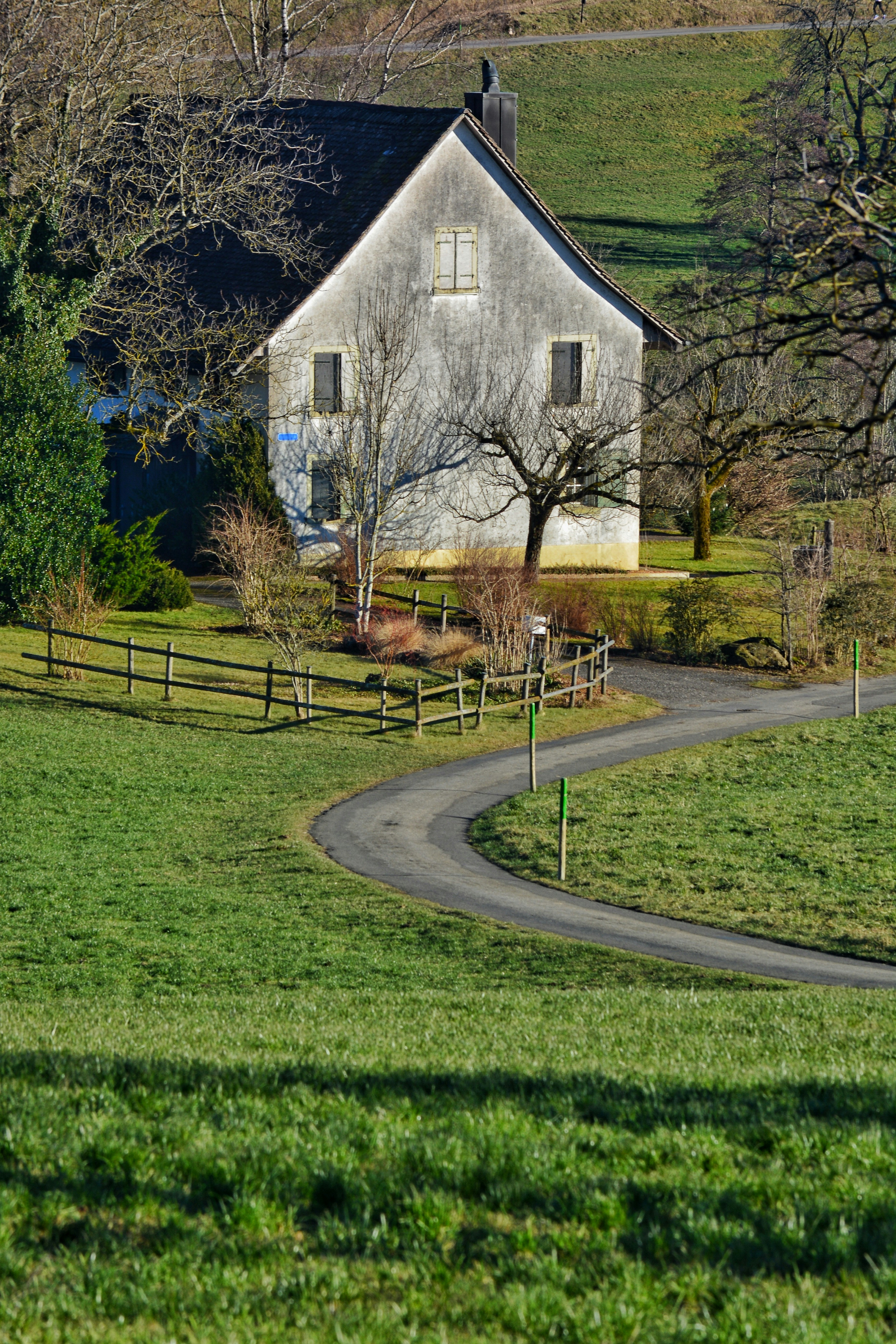 white and brown wooden house near green grass field during daytimePeter Steiner 🇨🇭 1973