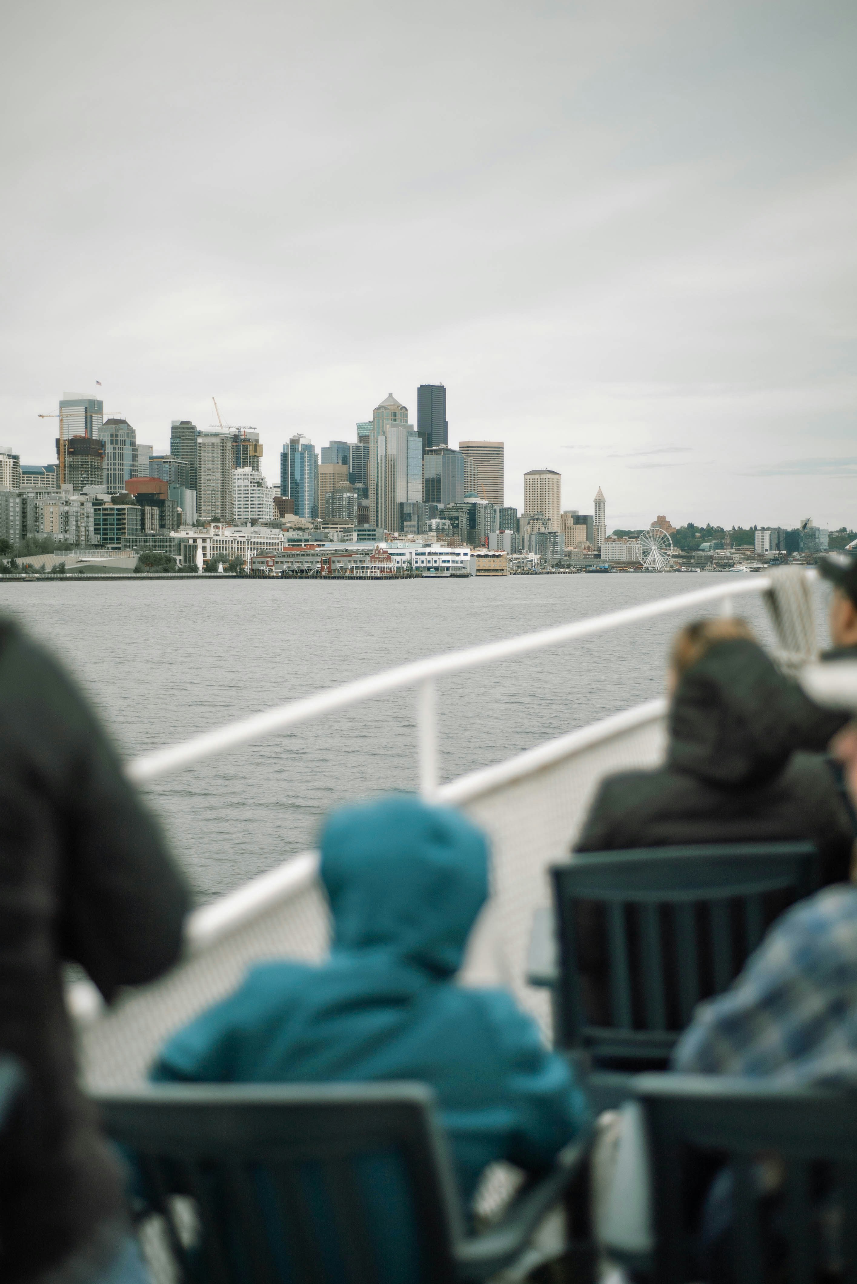Urban Glass and Water: A Ferry Glides by Seattle’s Skyscrapers