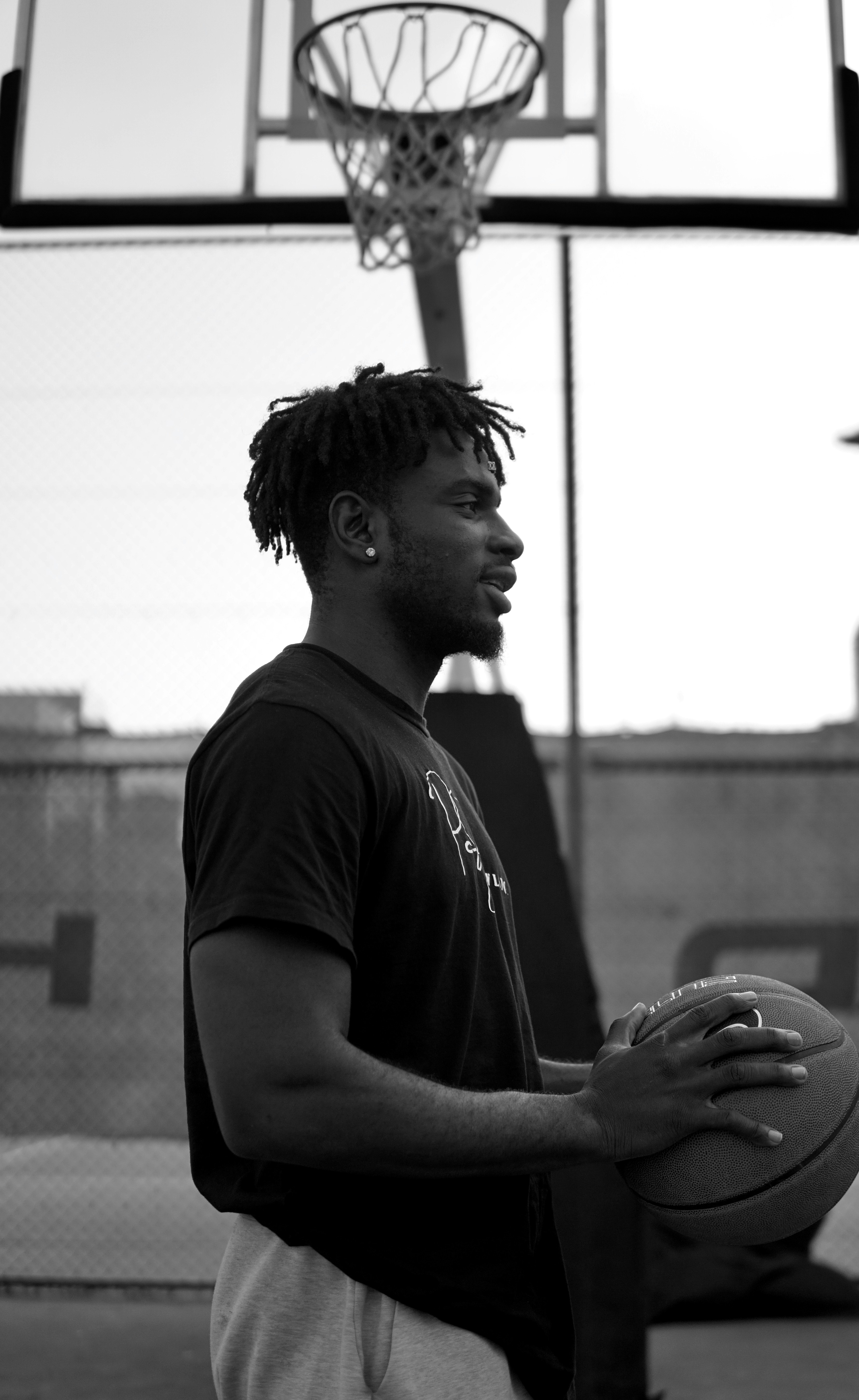 Quiet Moment on the Court: Portrait of Focus Under the Hoop